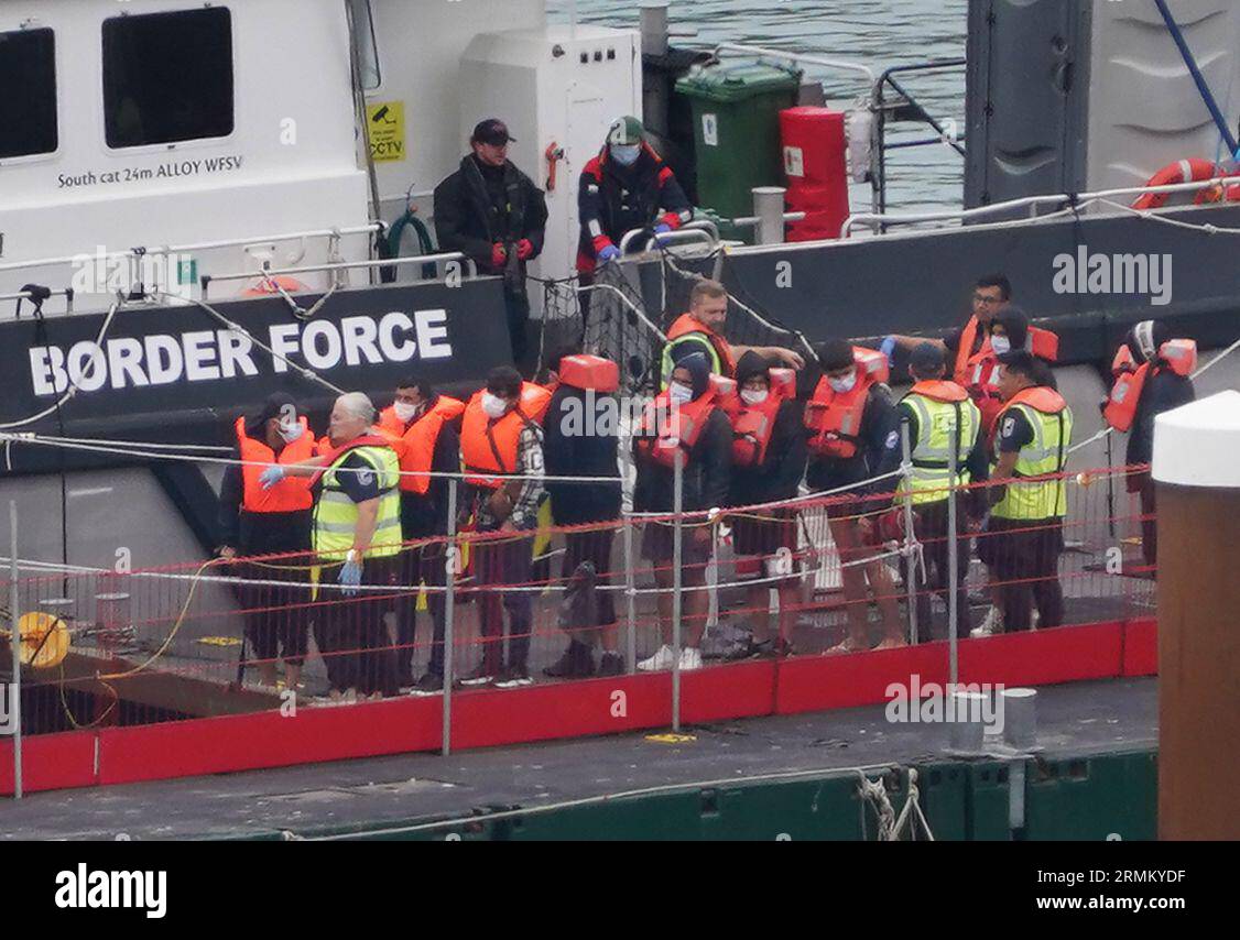 A group of people thought to be migrants arrive in Dover, Kent, onboard ...