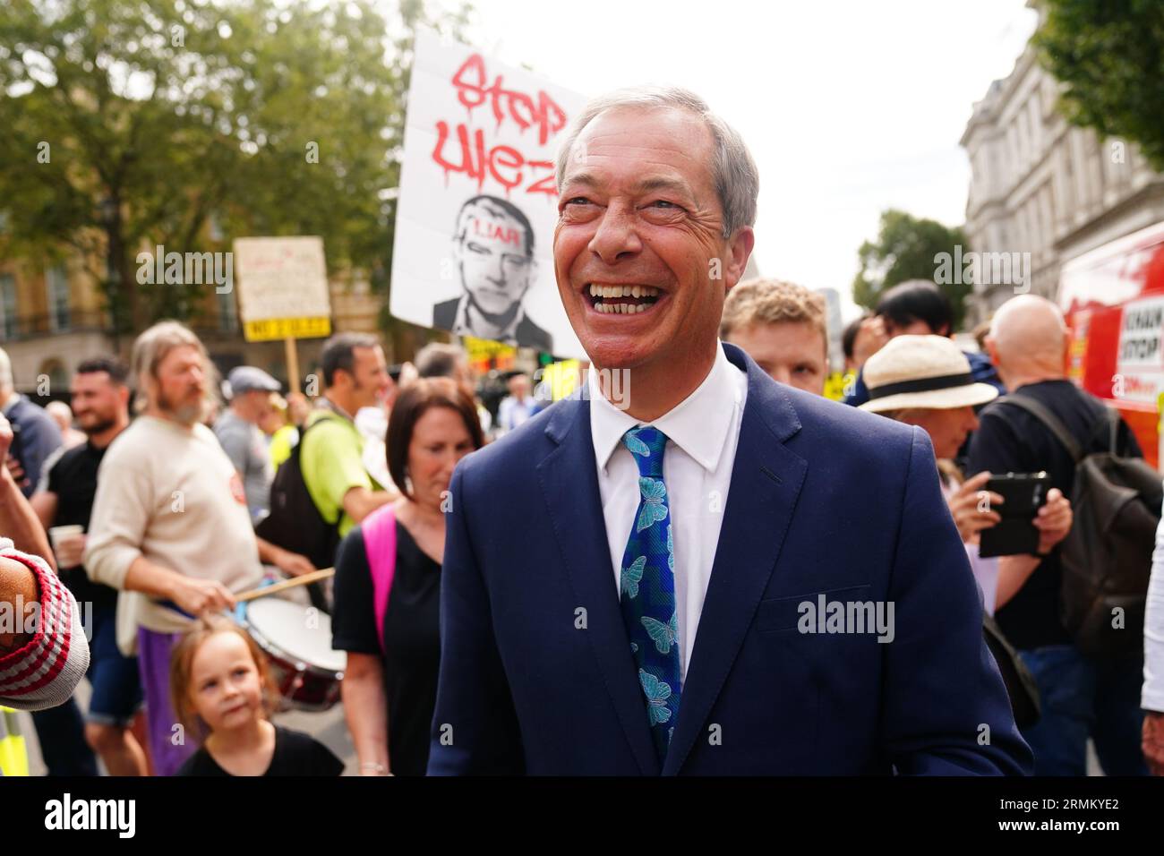 Nigel Farage speaks with protesters outside Downing Street in central ...