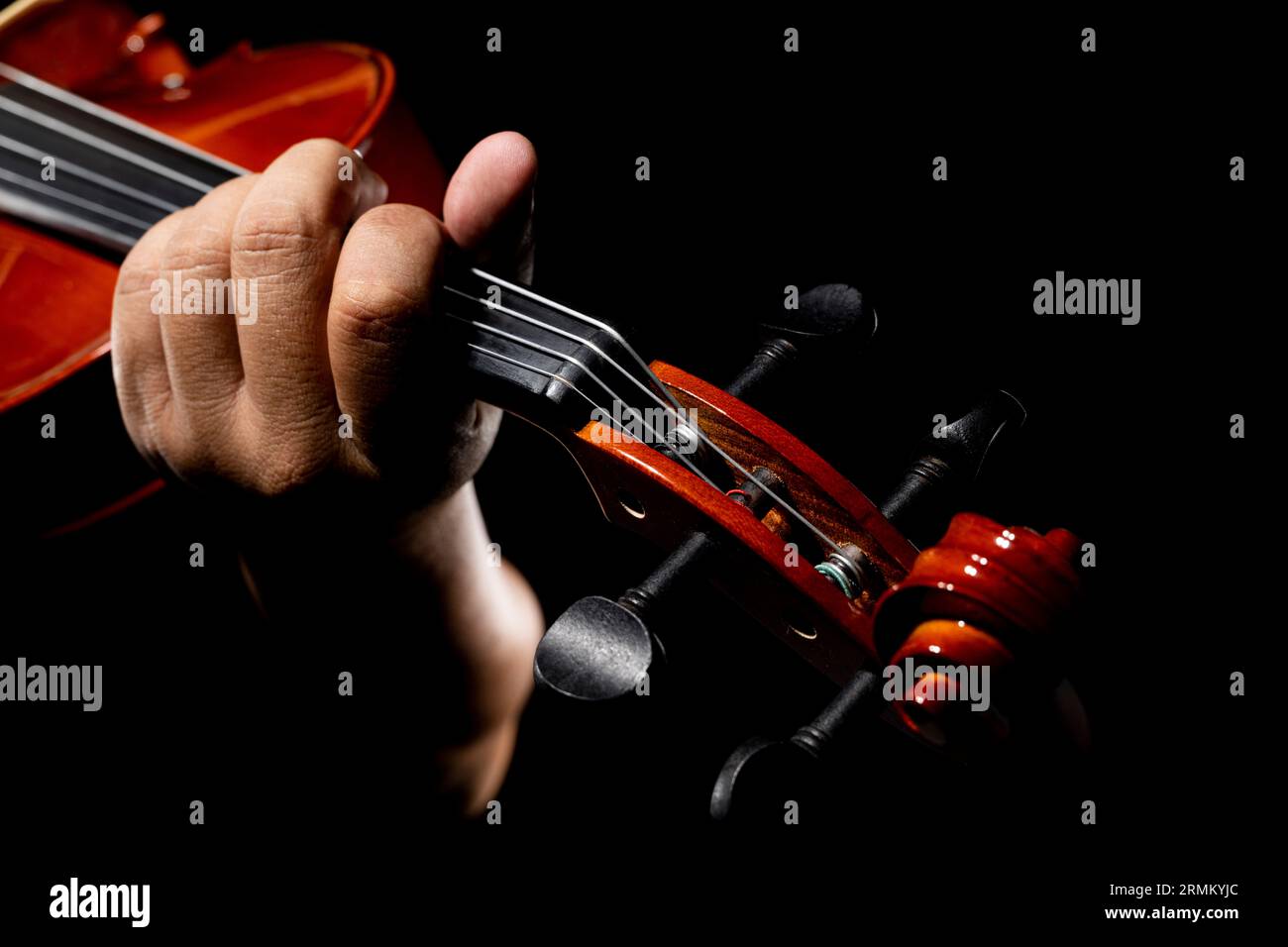 Musician playing violin. A Violinist or violin player performing with a ...