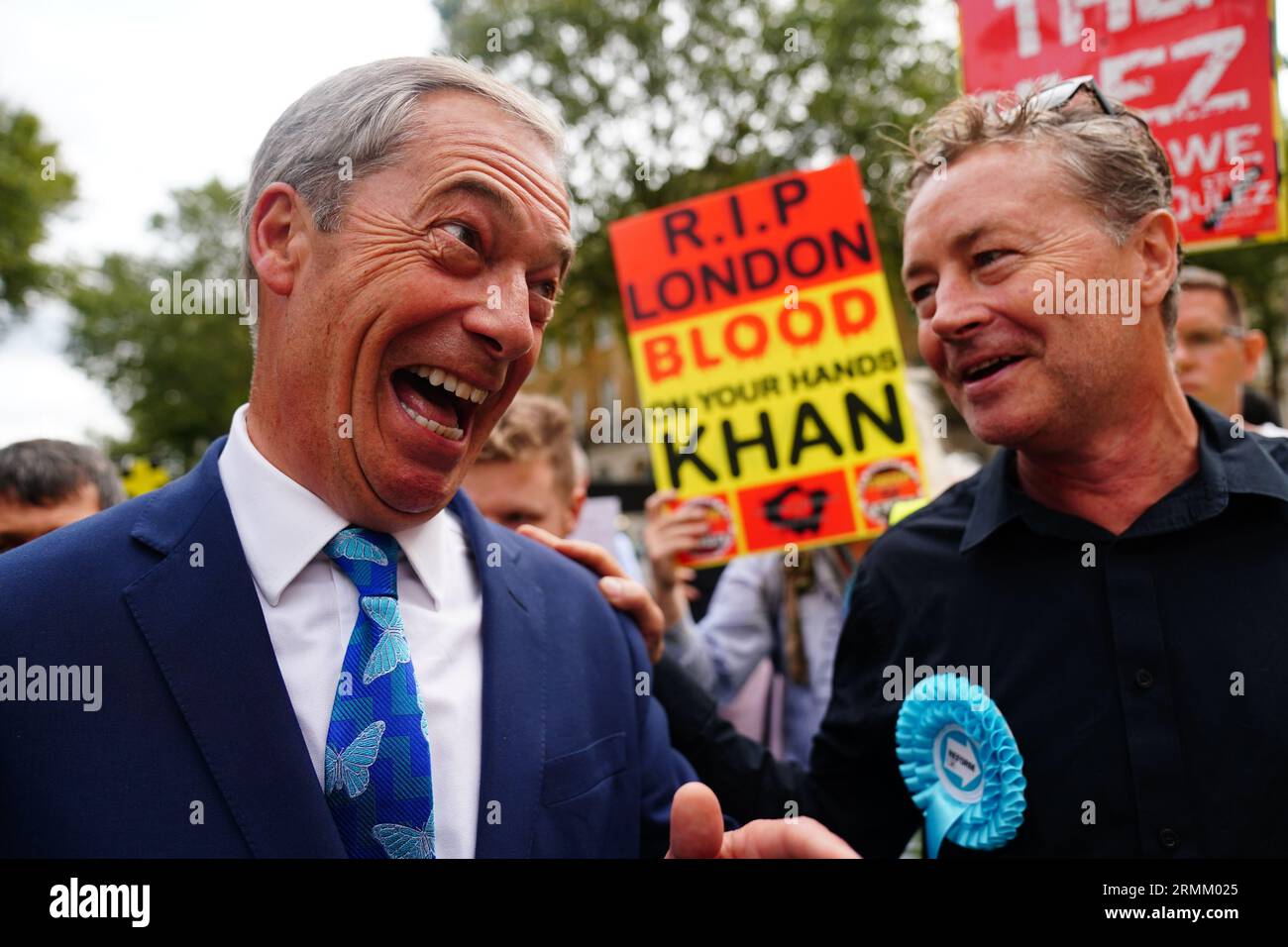 Nigel Farage speaks with protesters outside Downing Street in central ...