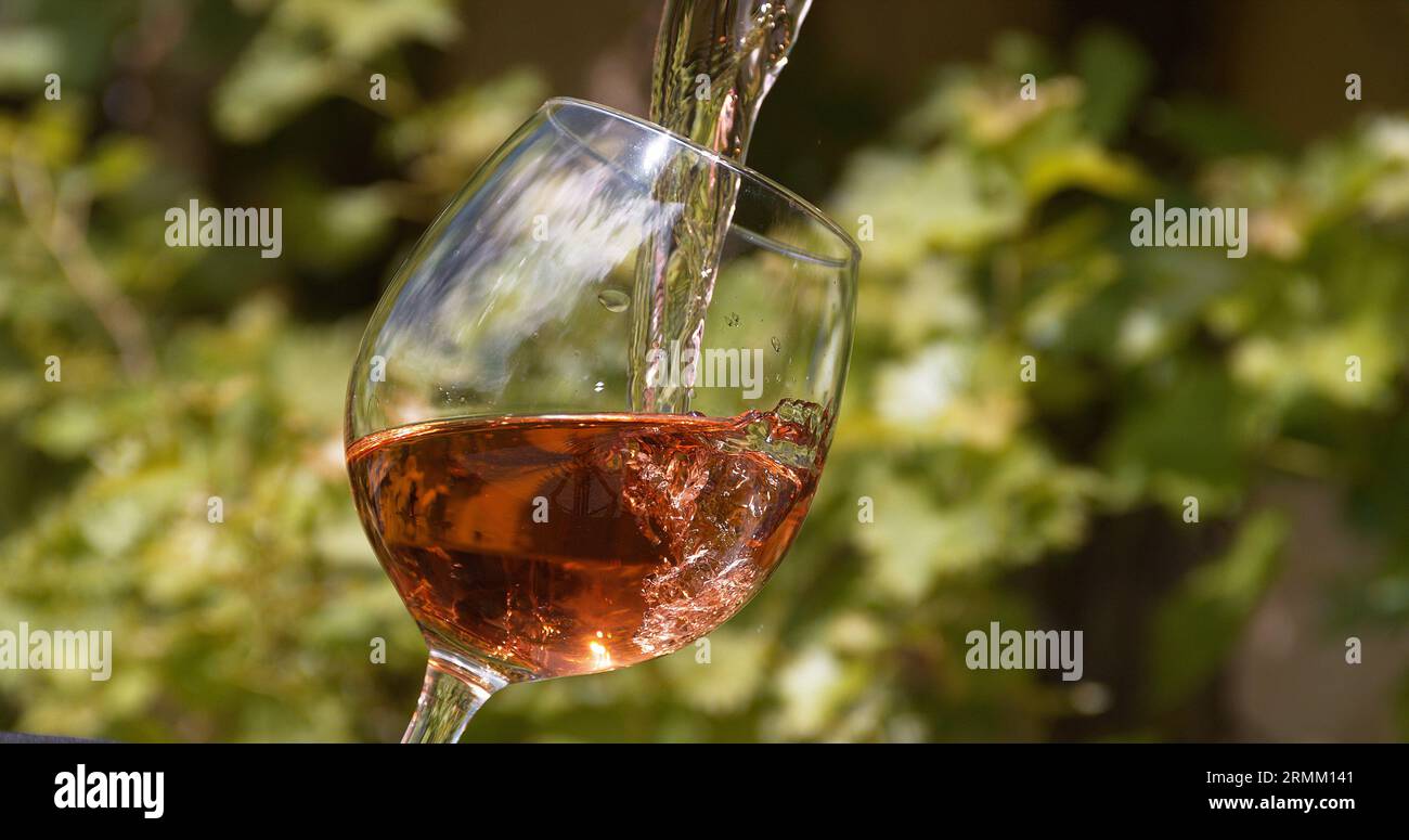 Pink wine flowing glass hi-res stock photography and images - Alamy