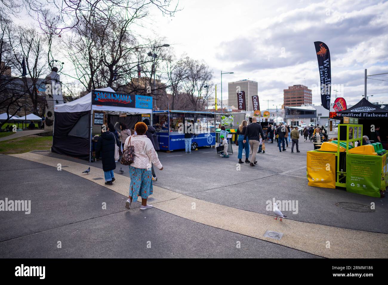 Weekend country market in a park in Australia. Family’s and people at a ...