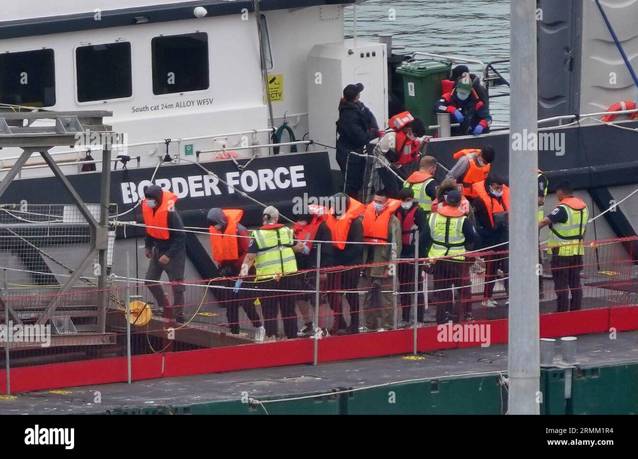A group of people thought to be migrants arrive in Dover, Kent, onboard ...