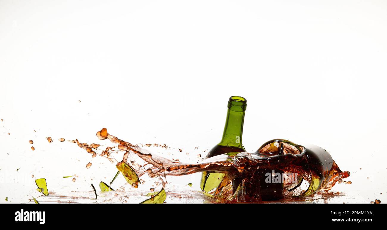 Bottle of Red Wine Breaking and Splashing against White Background ...