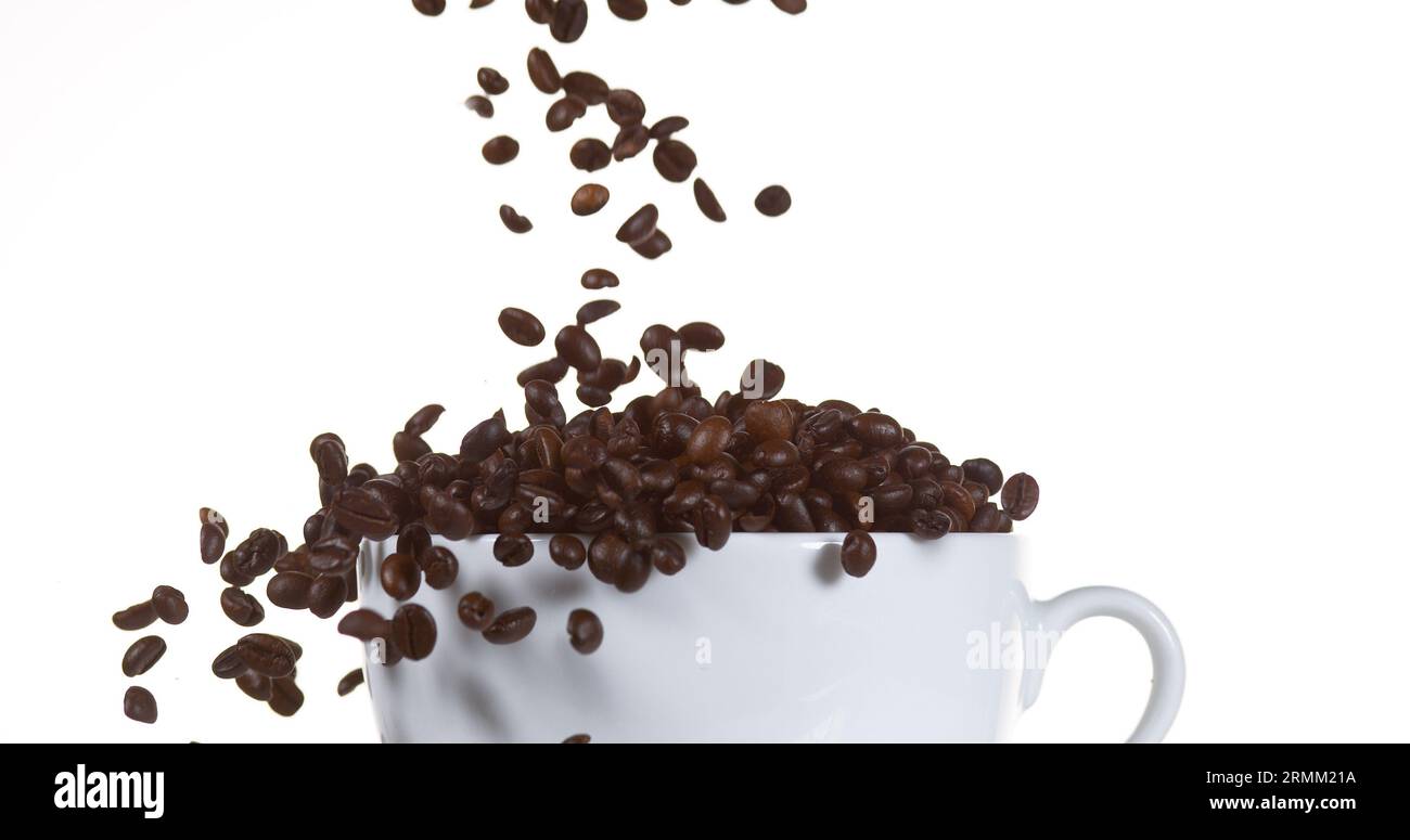 Coffee beans falling out cup hi-res stock photography and images - Alamy