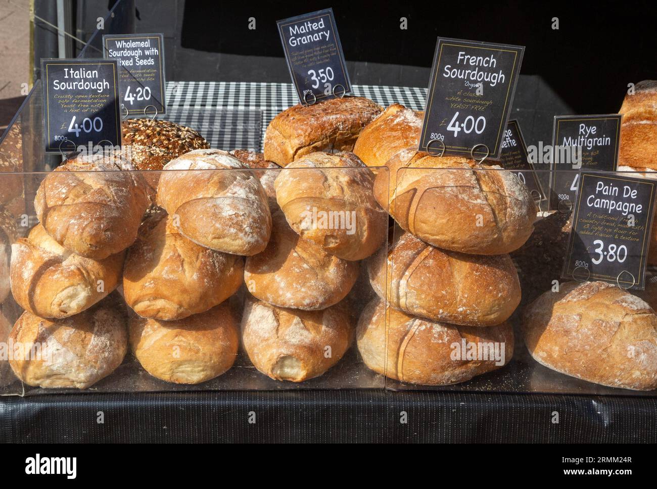 Fresh Loaves Of Artisan Bread On Sale At Street Market Stall