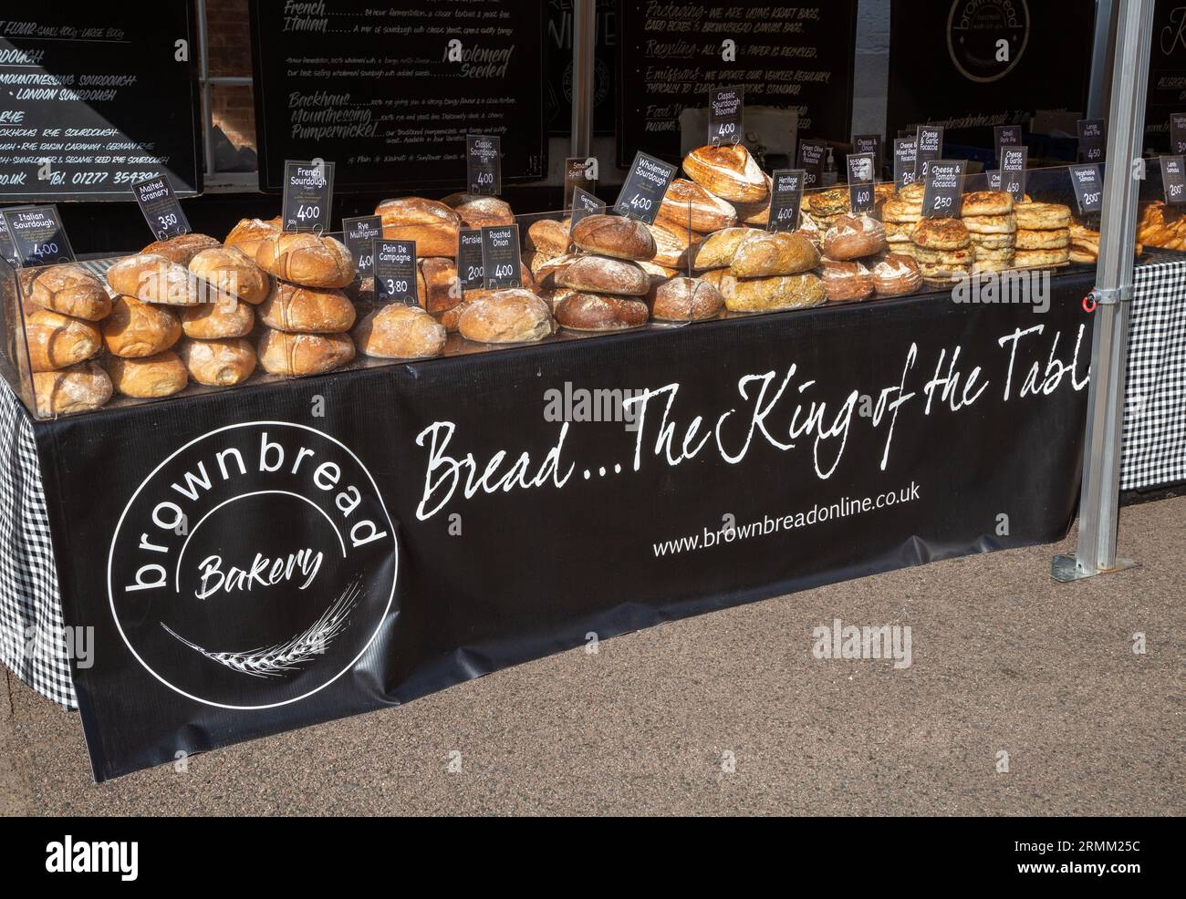 Fresh loaves of artisan bread on sale at street market stall ...