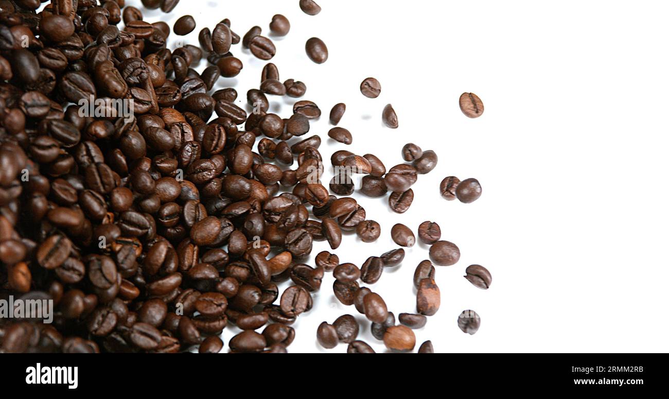 Coffee beans falling against white hi-res stock photography and images ...