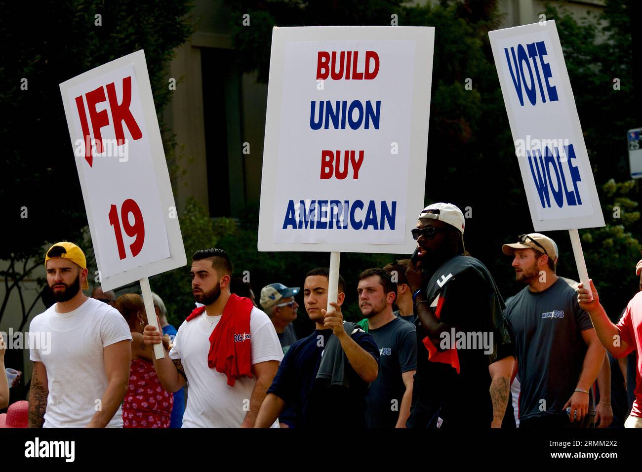 Participants carry signs in support of the Labor Union movement during ...
