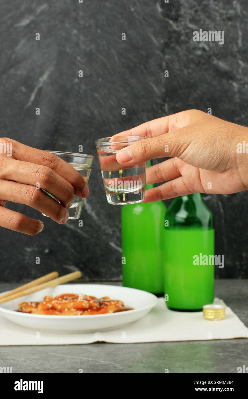 Drinking Korean Soju with Tteokbokki, Korea Lifestyle Stock Photo - Alamy
