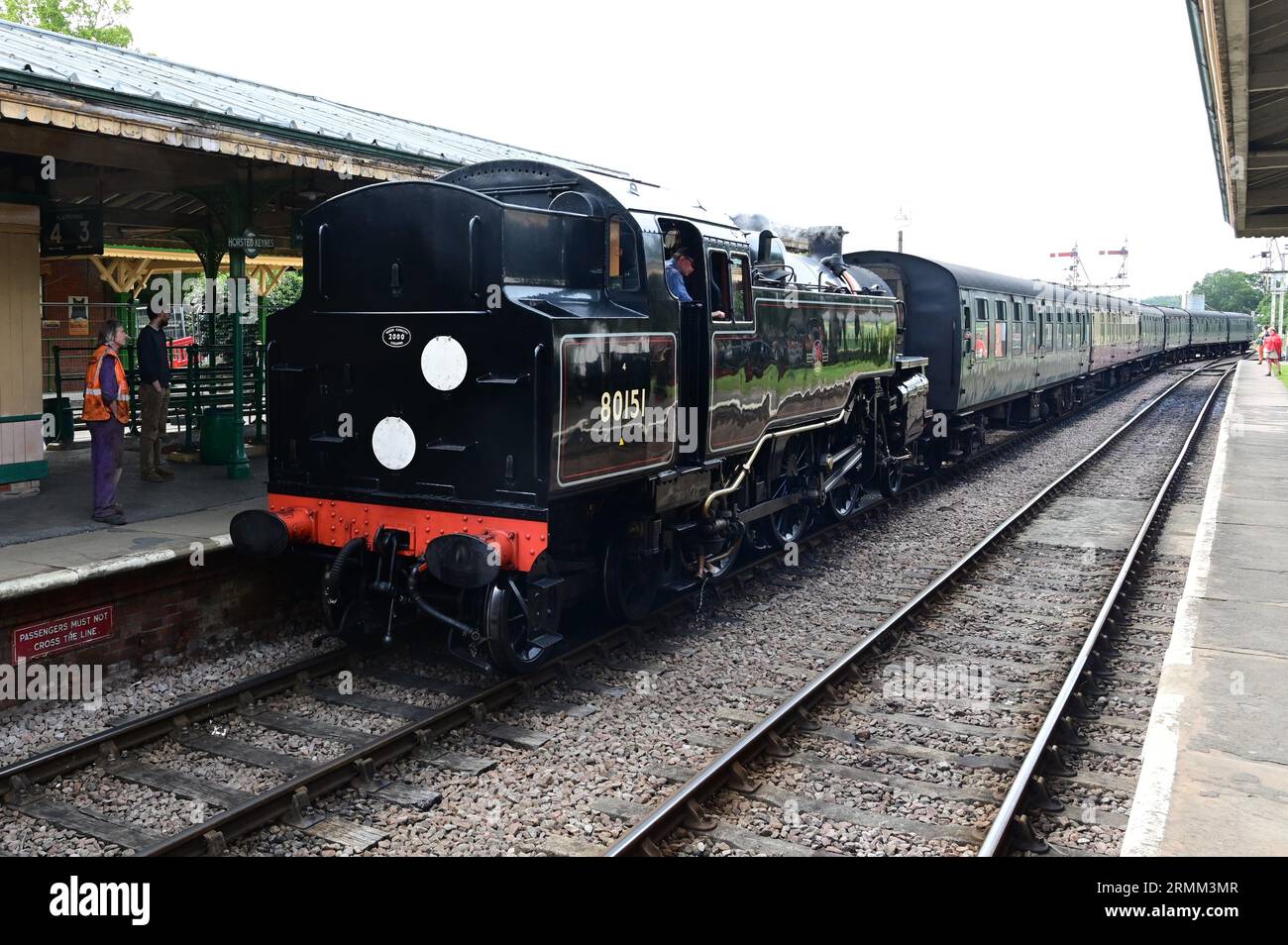 A standard class 4MT tank engine pulling out of Horsted Keynes station ...