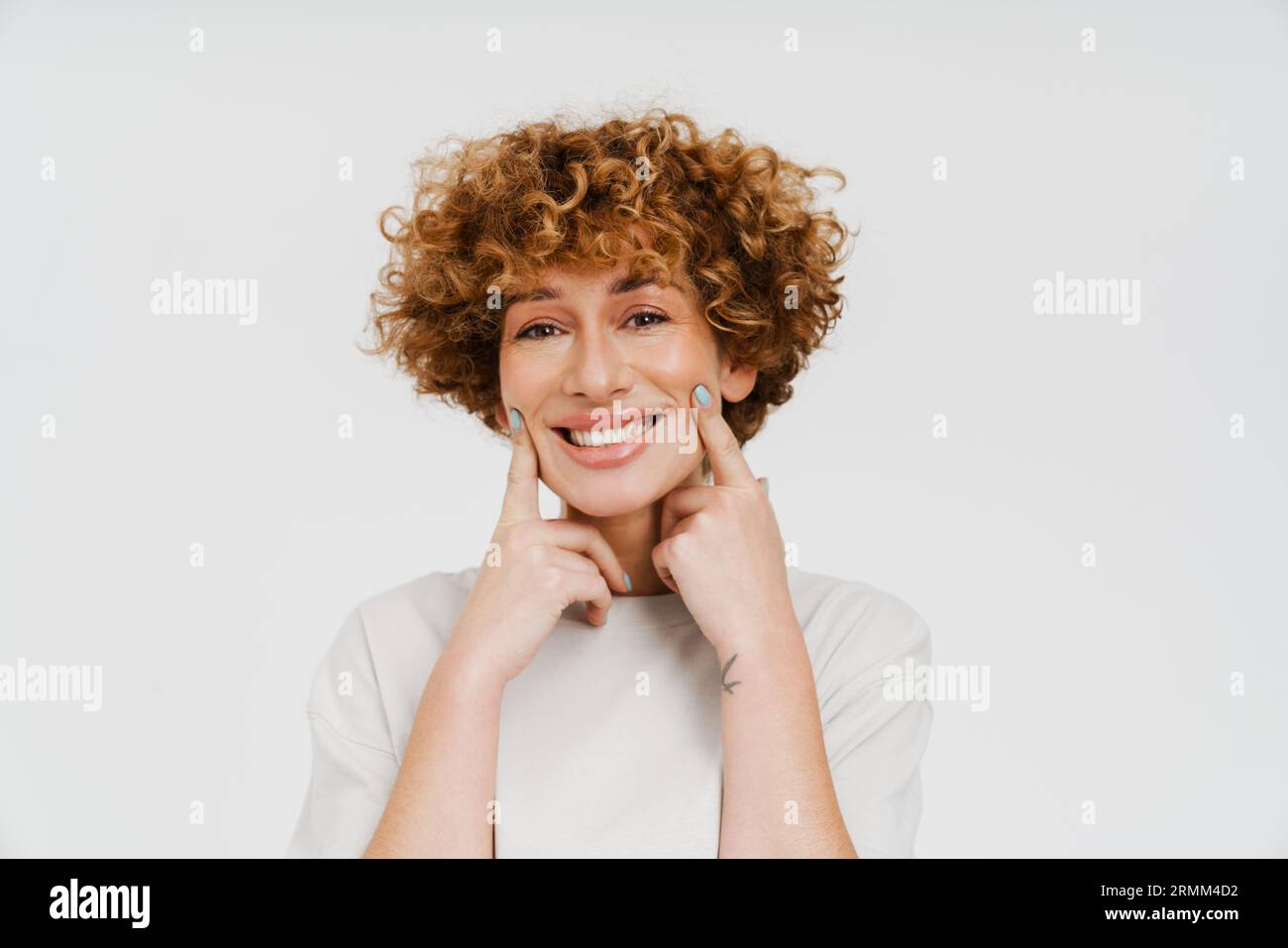 Fingers on cheeks hi-res stock photography and images - Alamy