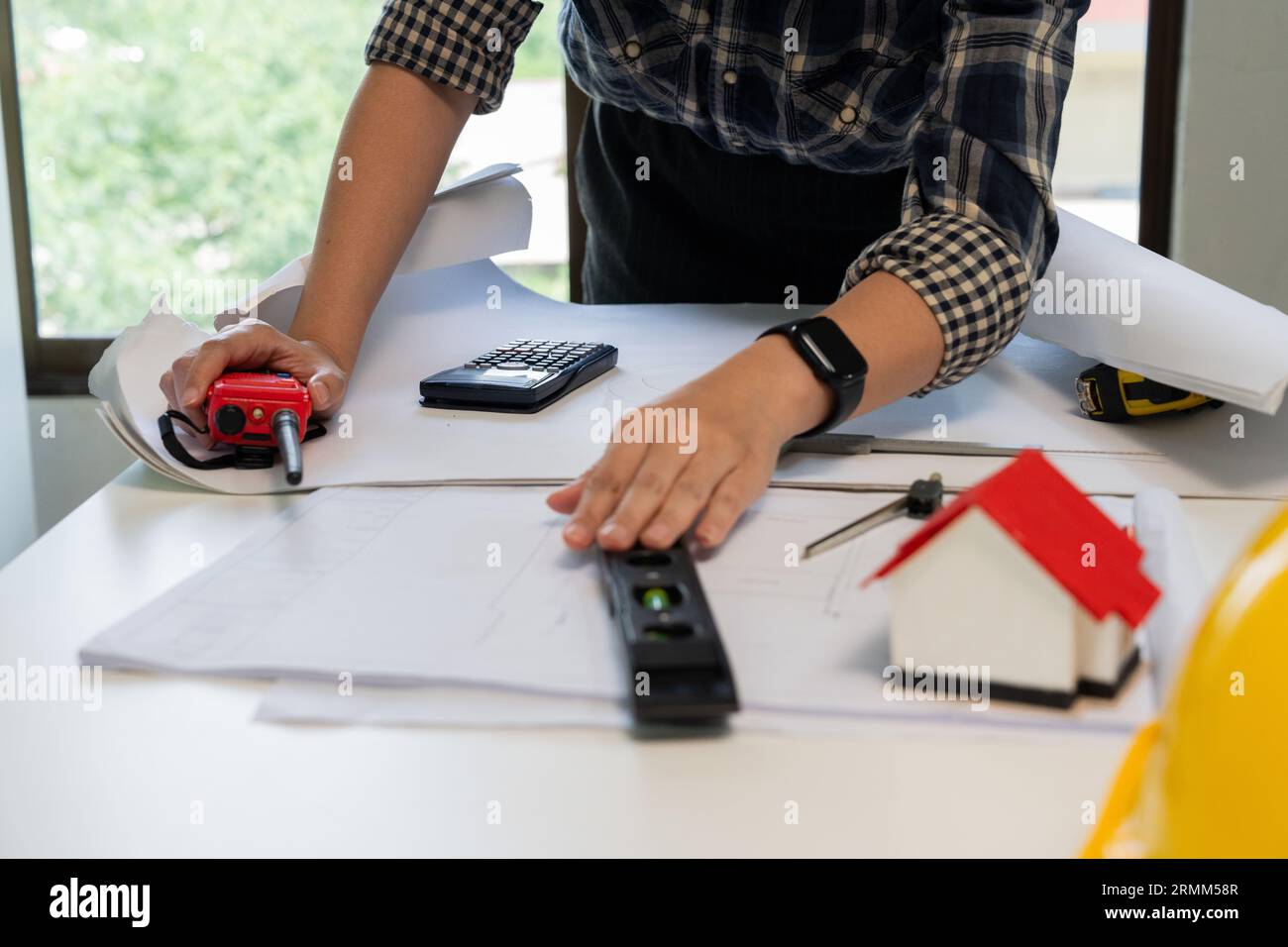 architect working with blueprints, engineer inspection in workplace for ...