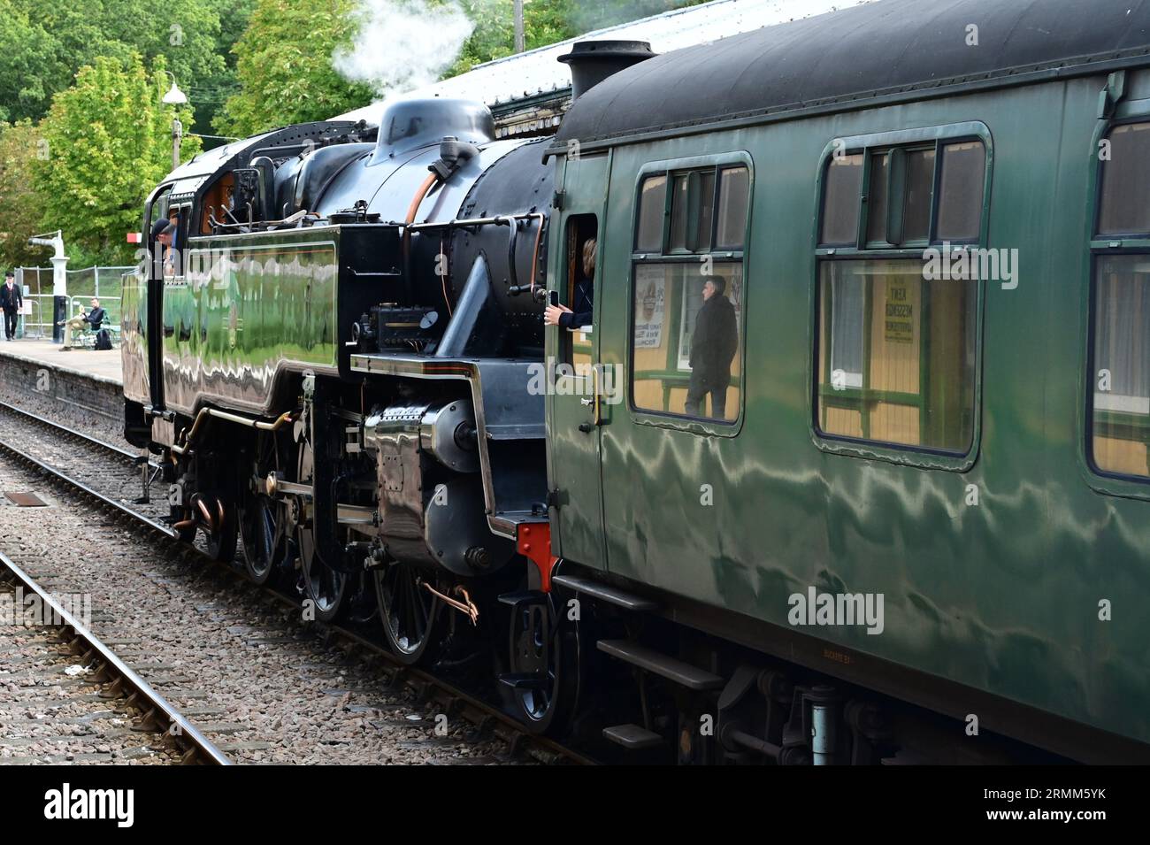 A standard class 4MT tank engine pulling out of Horsted Keynes station ...