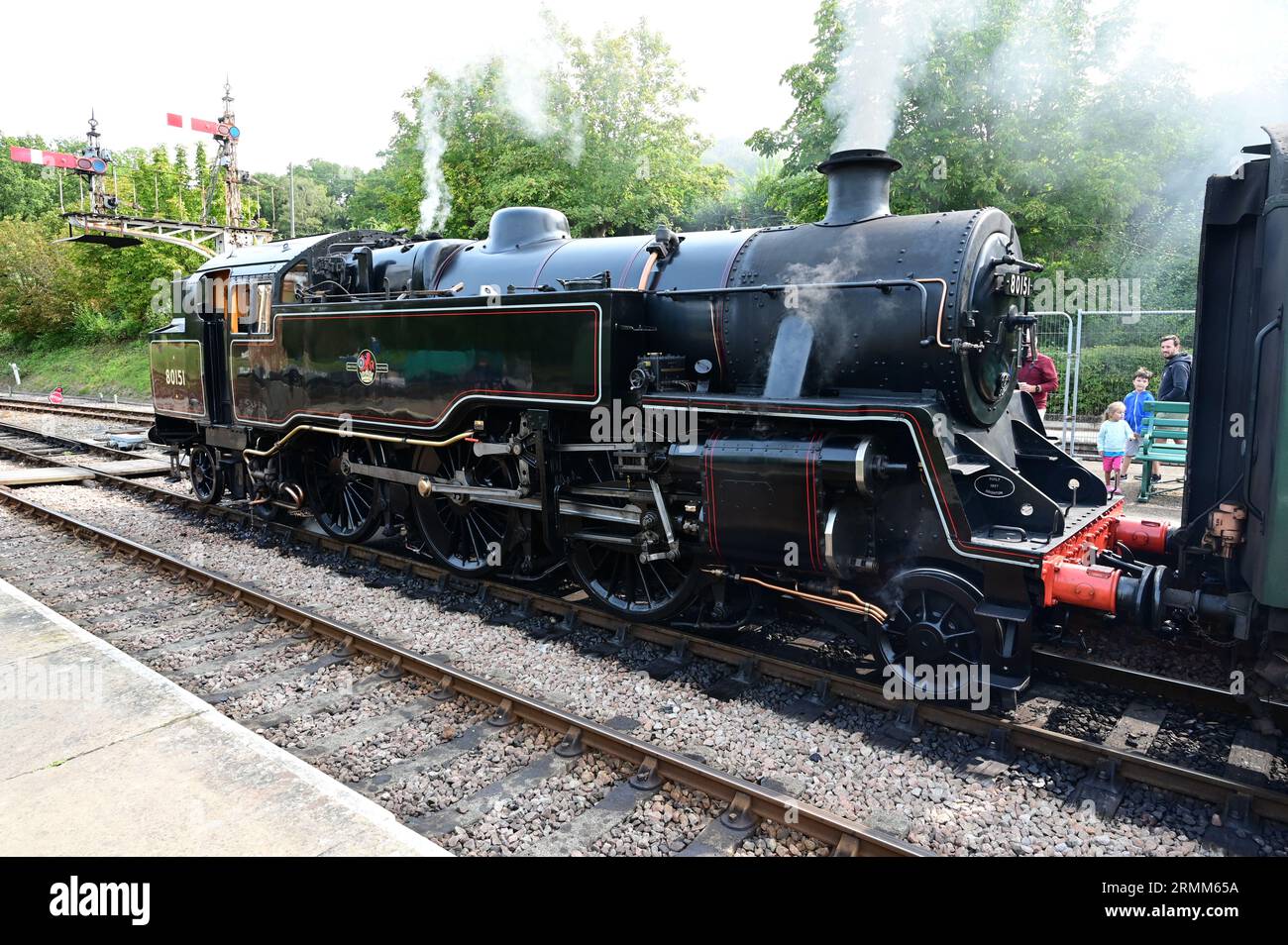 A standard class 4MT tank engine pulling out of Horsted Keynes station ...
