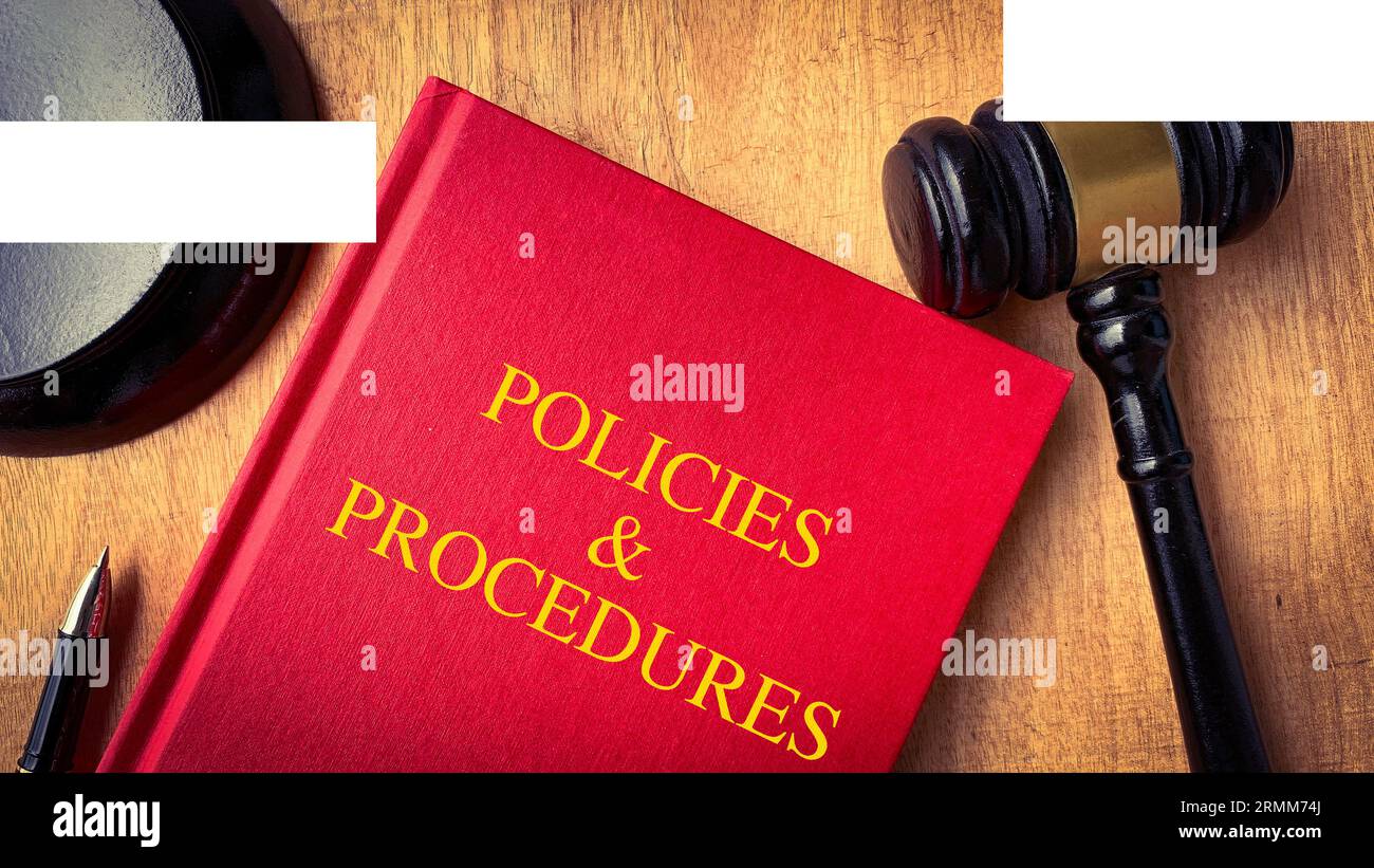 Top view of Policies and Procedures red cover book with gavel as ...