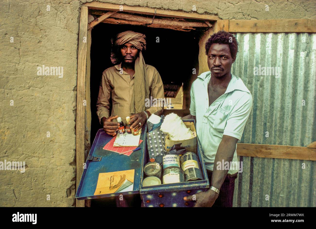 Mali. Men showing medicine supplies of a village clinic Stock Photo - Alamy