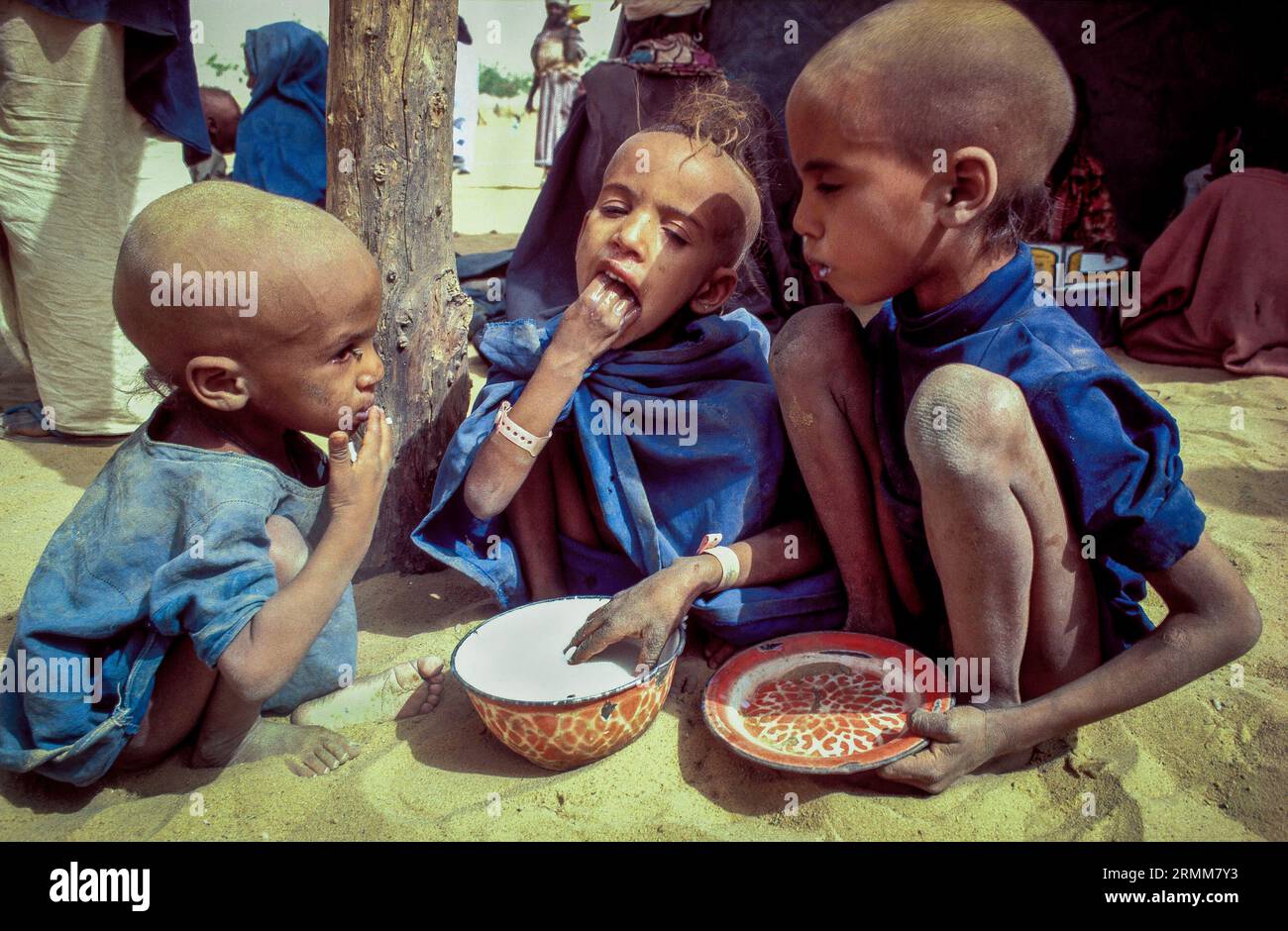 Mali, Gao. Undernourished children with food in a Red Cross refugee ...