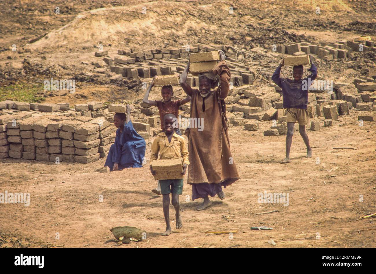 Mali. Children working in a stone factory Stock Photo - Alamy