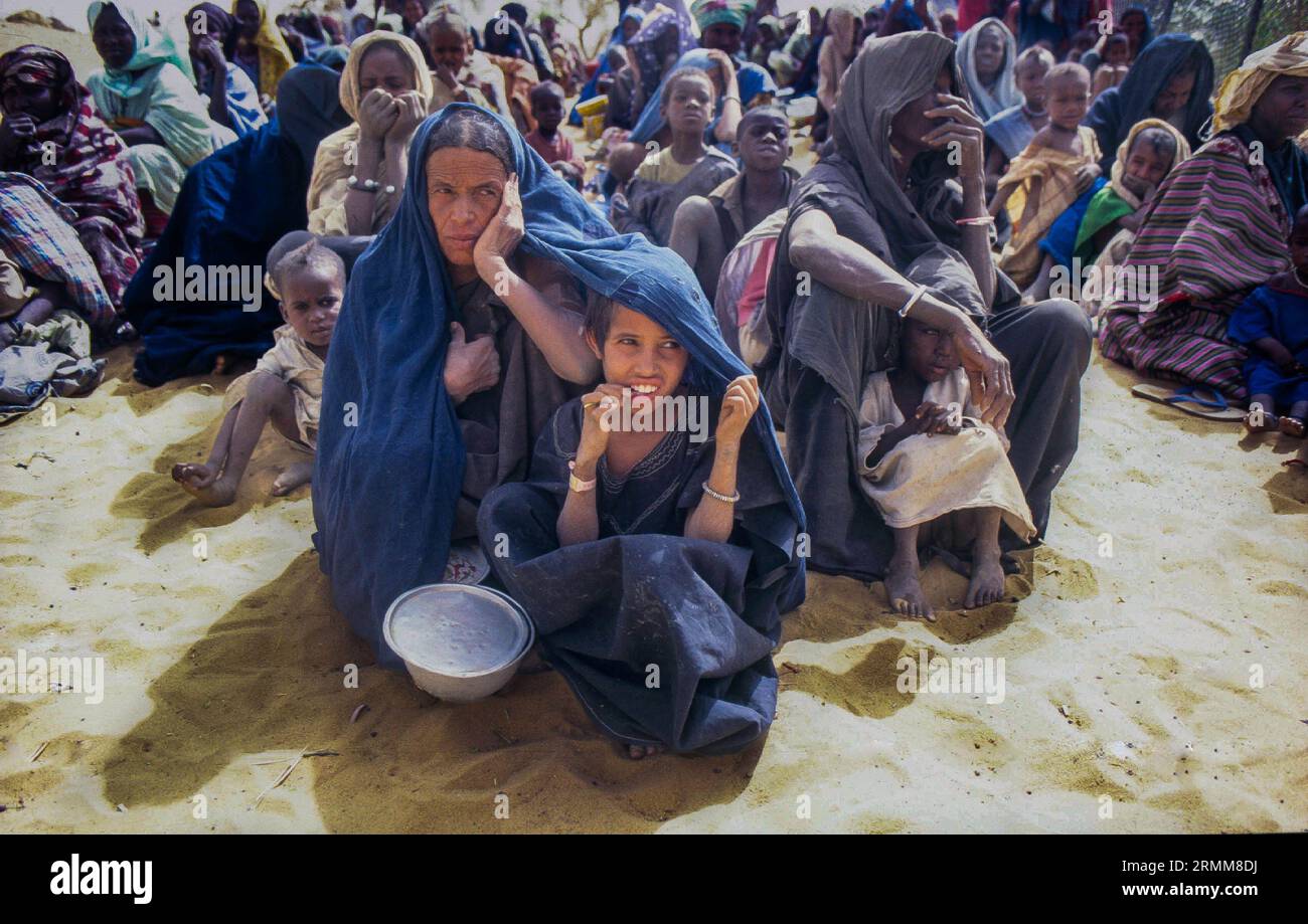 Mali, Gao. Undernourished women and children in line waiting for food ...