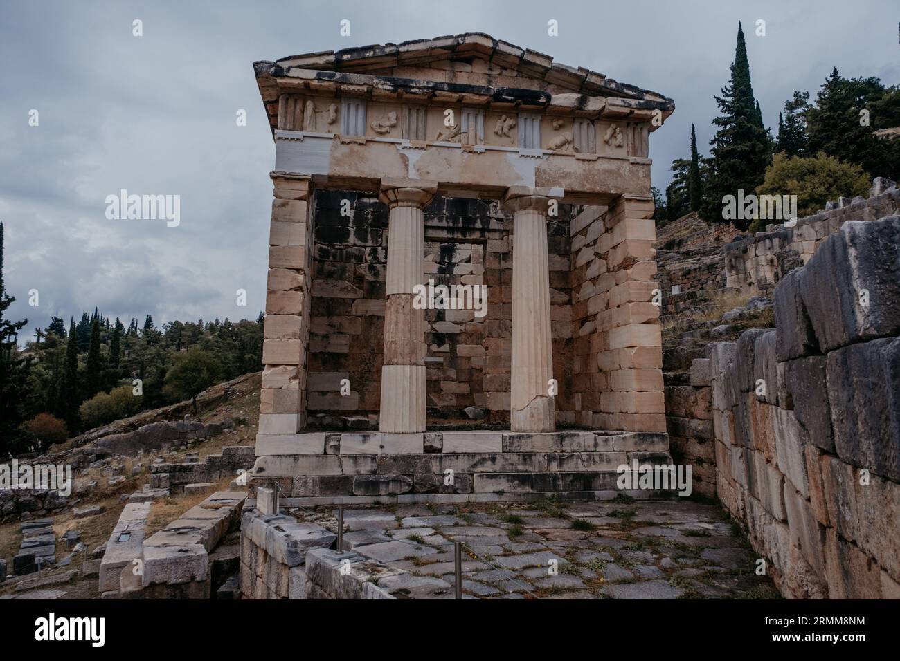 Ancient greek temple in ruins in mountains with trees oracle of apollo ...