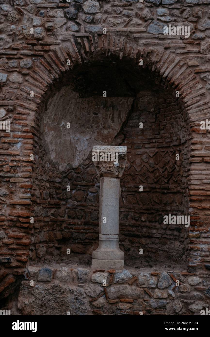 Ancient greek pillar in ruins in mountains, oracle of apollo delphi ...