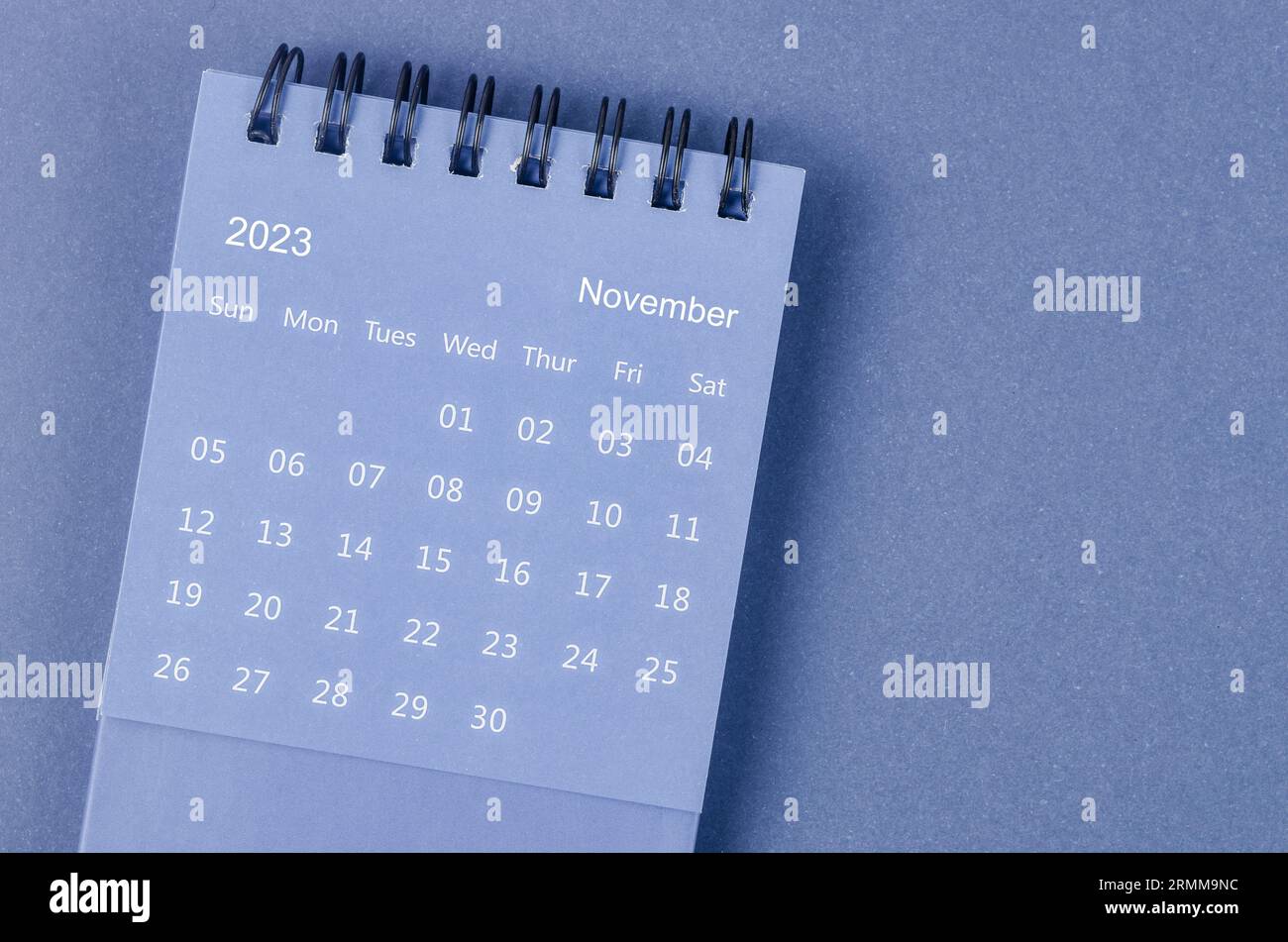 November 2023 Monthly desk calendar for 2023 year on blue background ...
