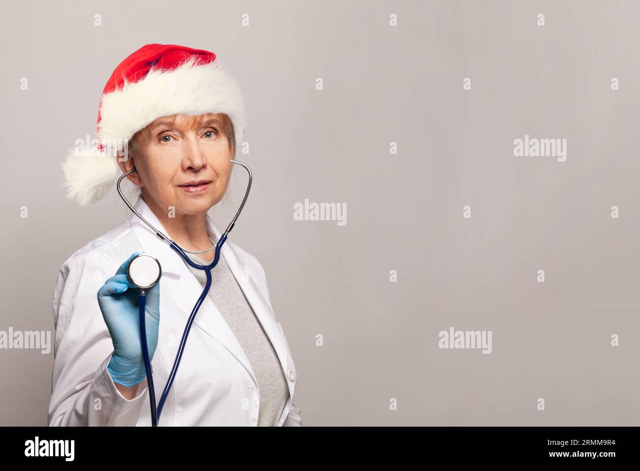 Christmas woman doctor in medical uniform with stethoscope, Christmas ...