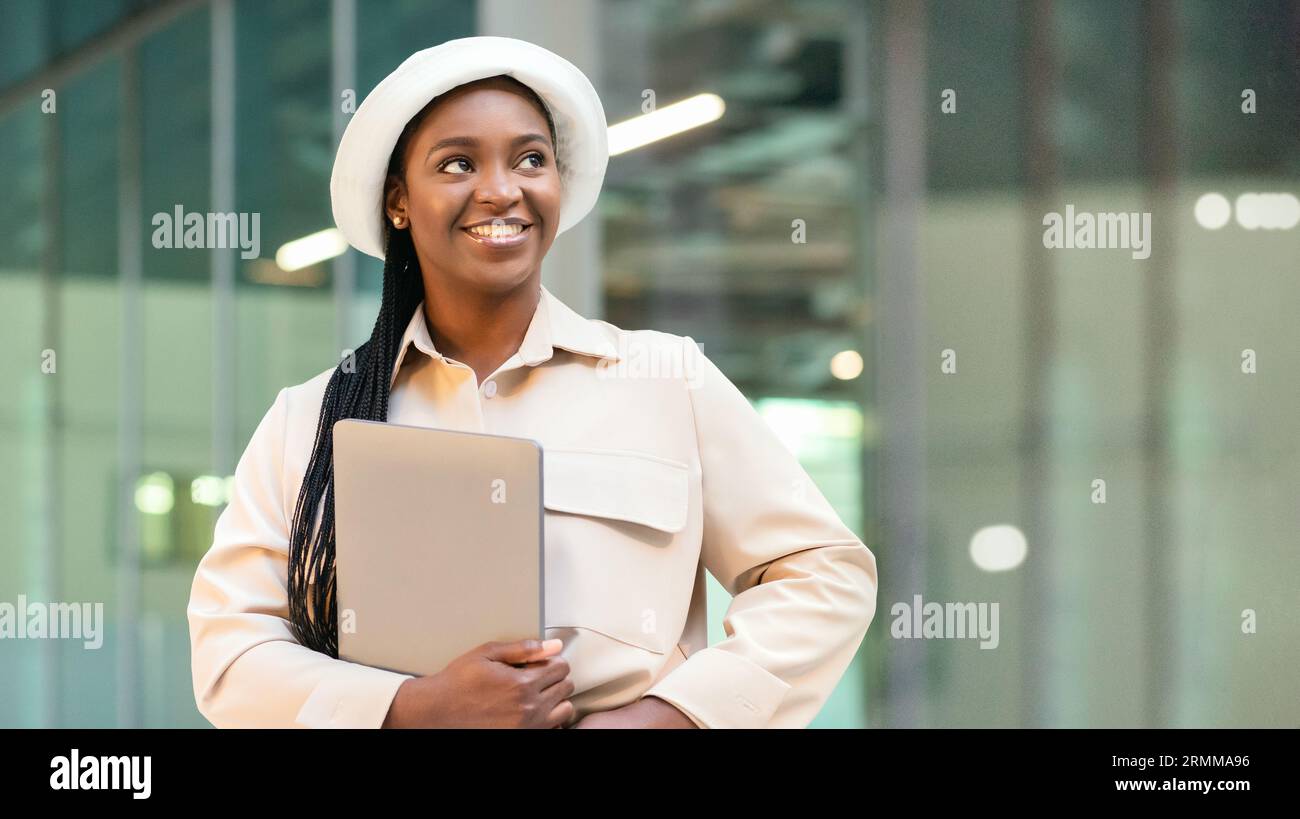 Pretty young african american lady student posing at college campus ...