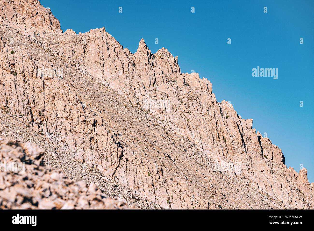 The allure of the desert unfolds, with eroded rock formations, blue ...