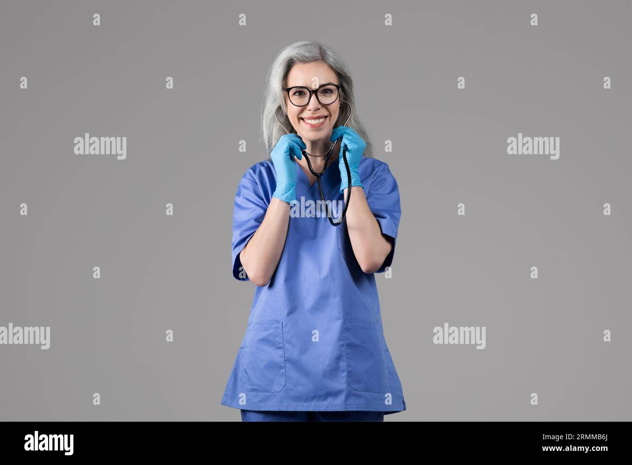 Woman wearing blue uniform hi-res stock photography and images - Alamy