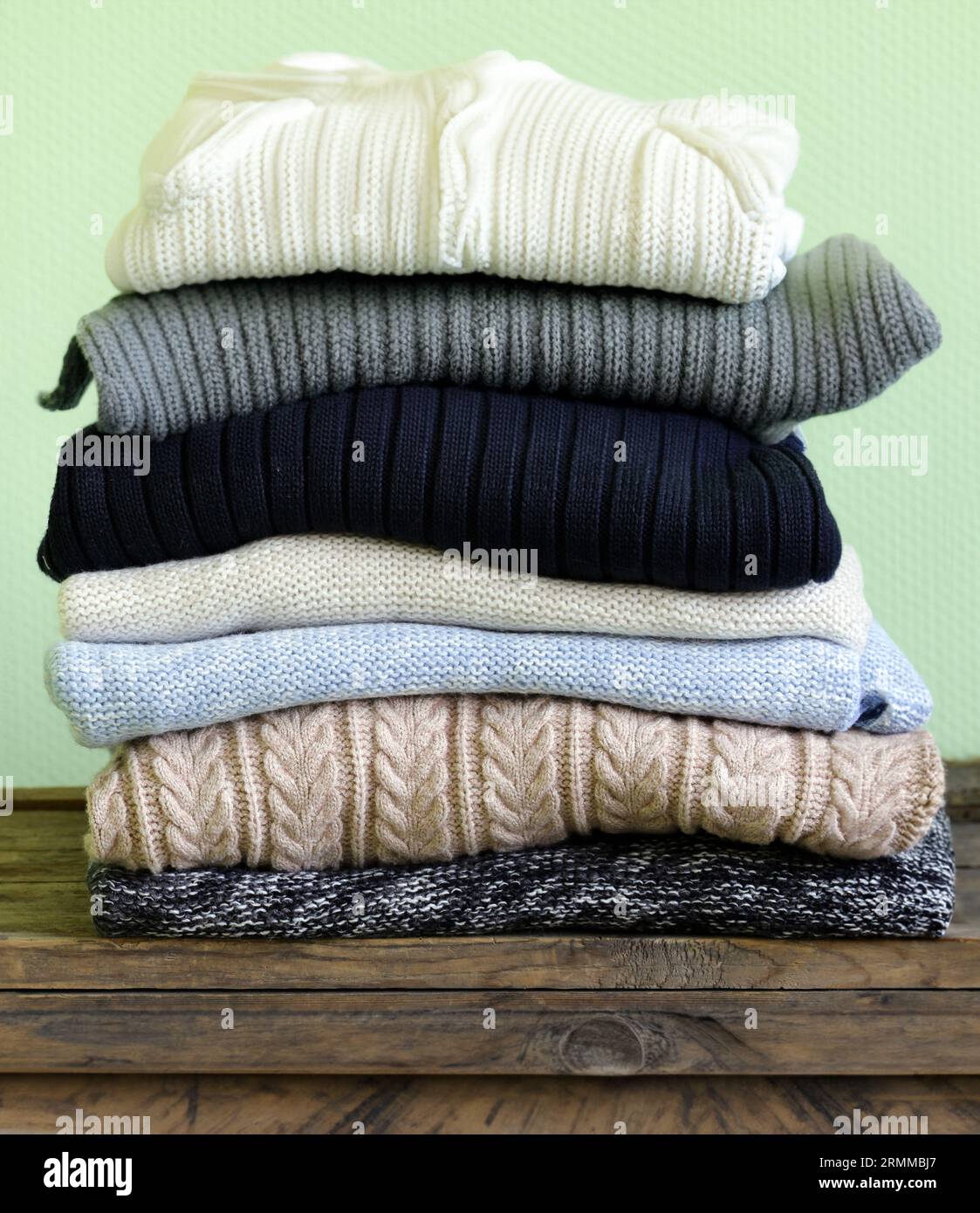 stack of knitted warm sweaters on a shelf Stock Photo - Alamy