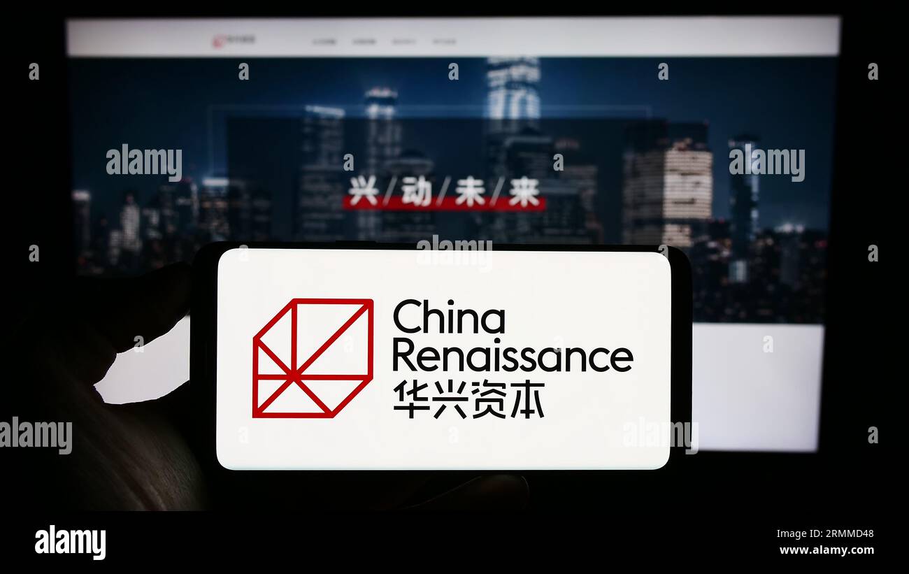 Person holding cellphone with logo of company China Renaissance ...