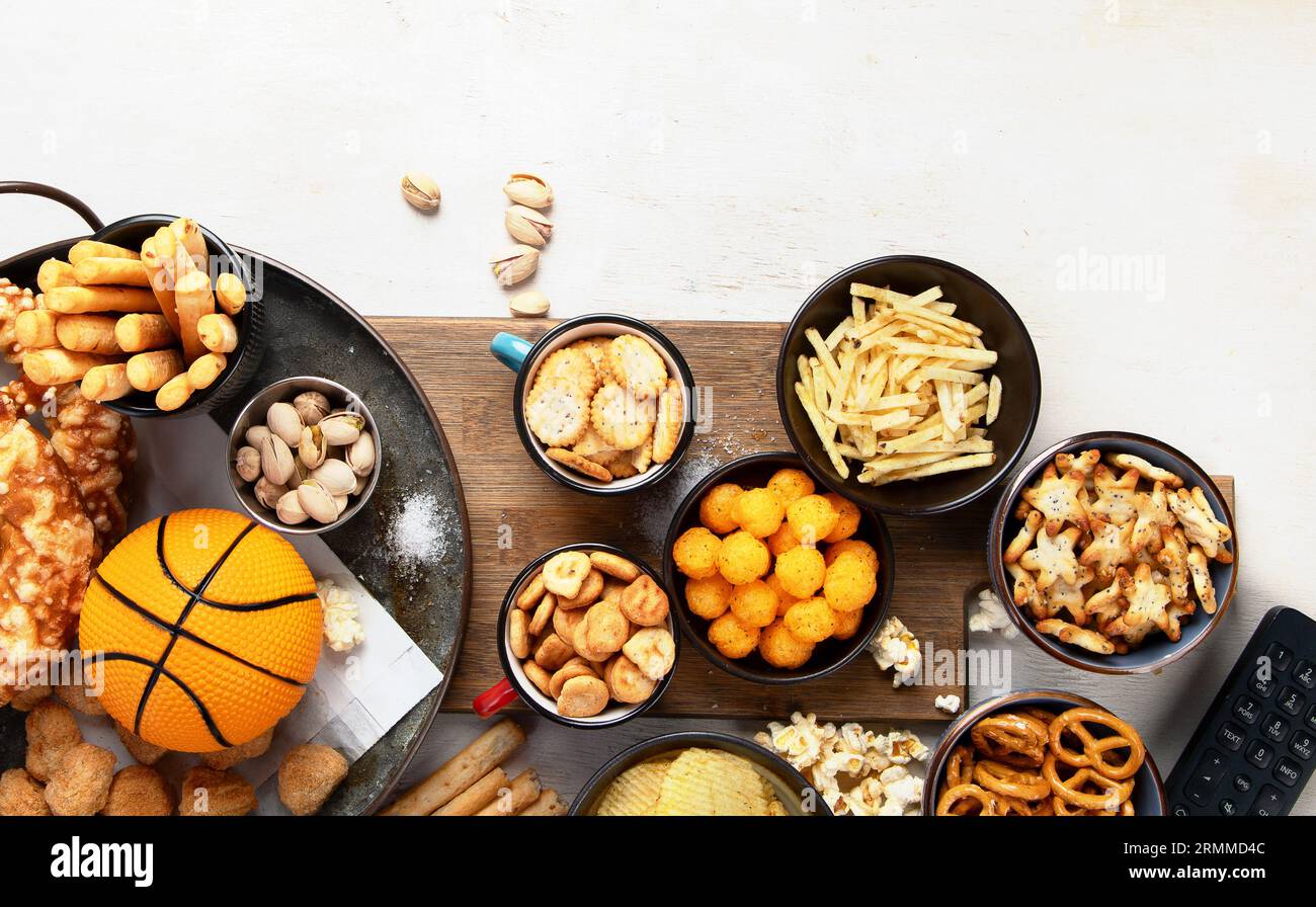 Set of various basketball fans and stadium snacks, chips, sauces on a ...