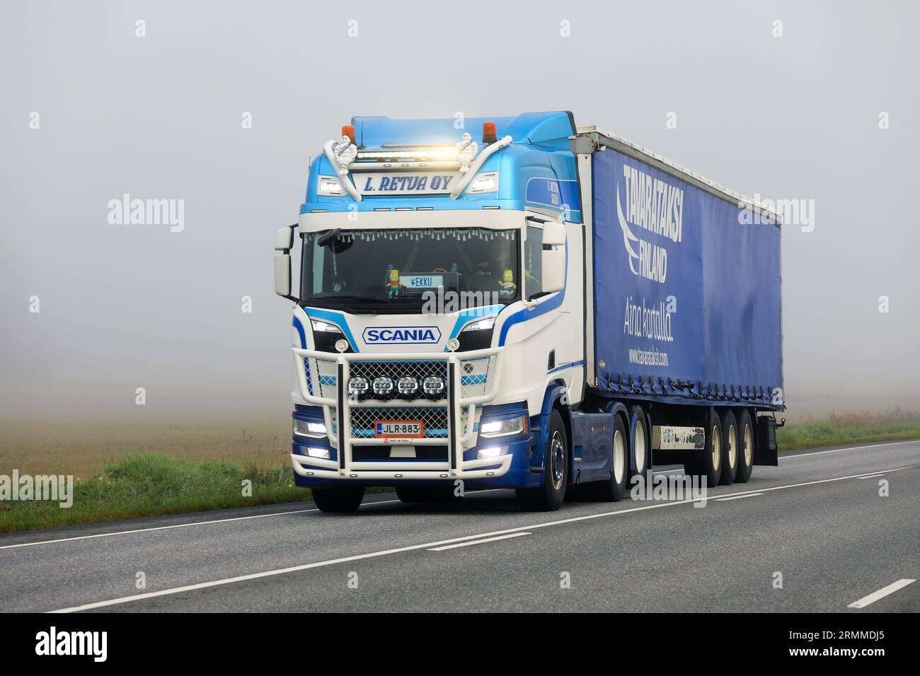 Customised Scania truck L Retva Oy pulls semi trailer on road 52 on a ...