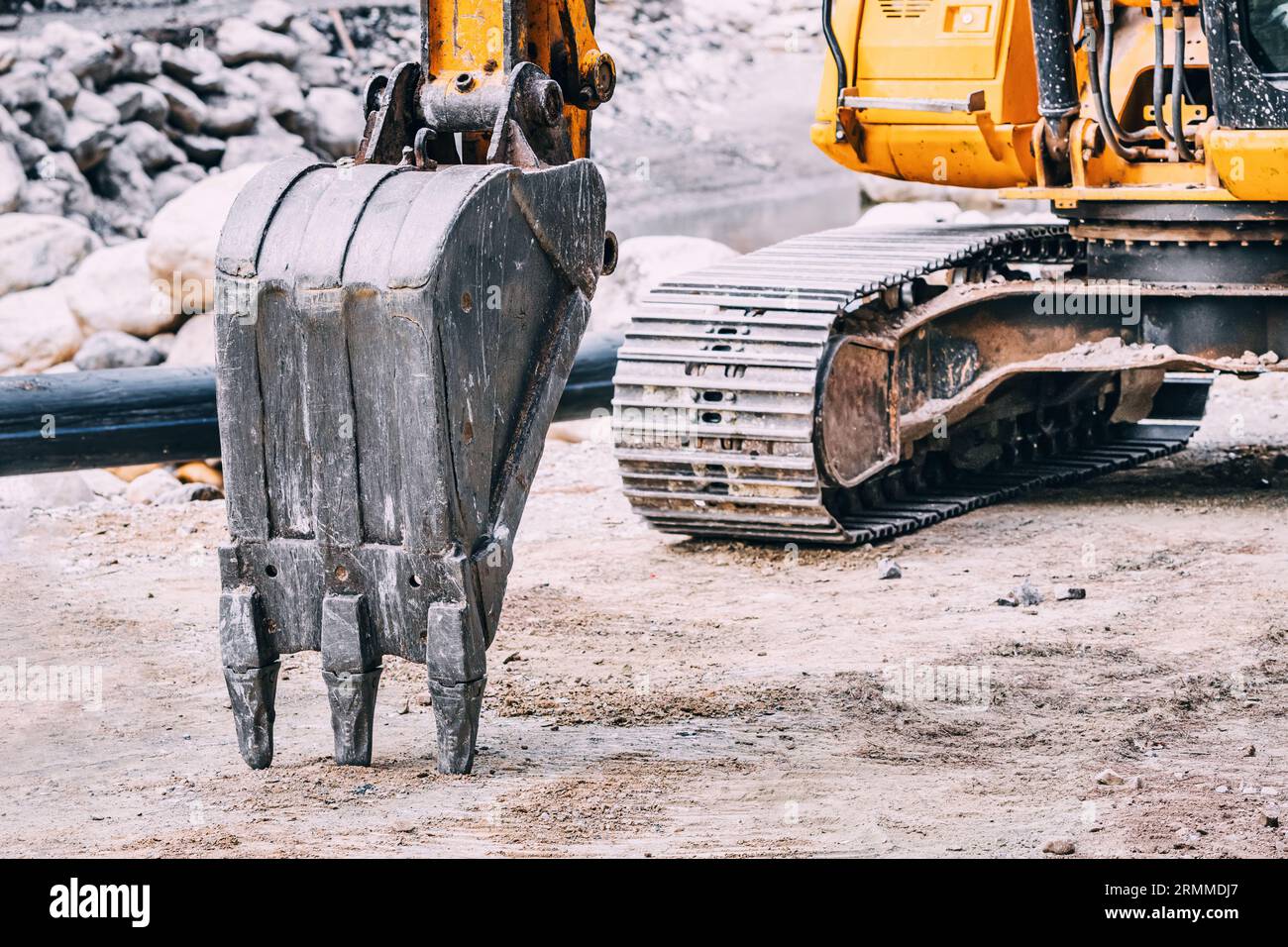 a bulldozer with its shovel works tirelessly, moving earth and ...