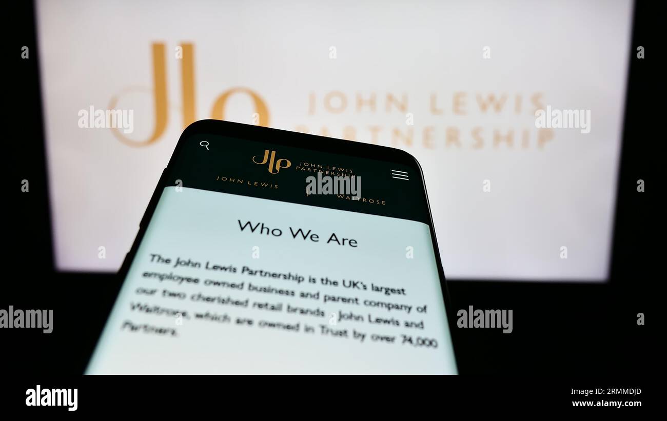 Mobile phone with website of retail company John Lewis Partnership plc ...