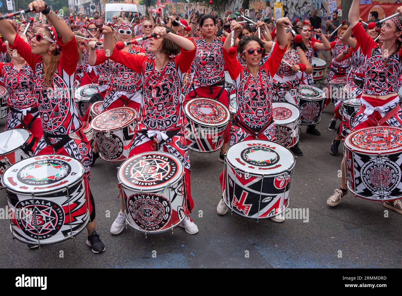 London, UK. 28th Aug, 2023. Samba drummers are performing on the street ...