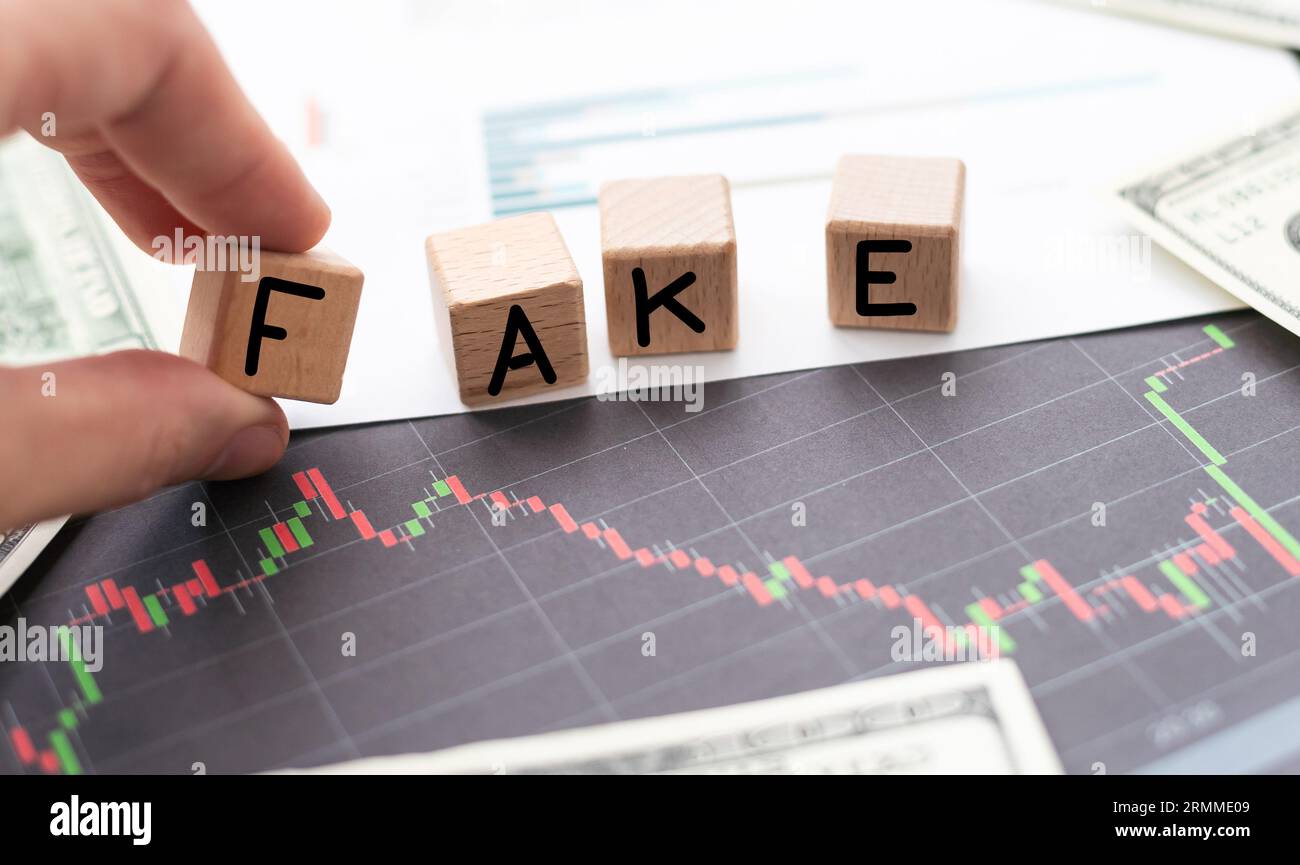 Businesswoman's Hand Replacing Wooden Cubic Blocks From Fake To Fact ...