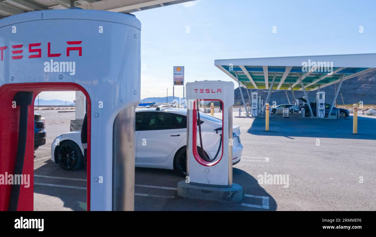 Daytime Tesla Charging, Supercharging Station Power-Up Stock Photo - Alamy