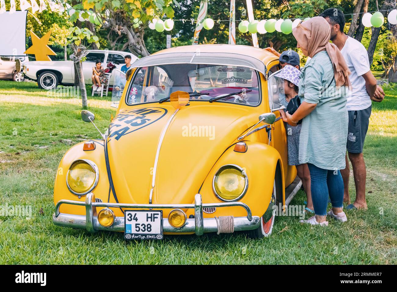 01 July 2023, Antalya, Turkey: Iconic Timepiece: Visitors admire the ...