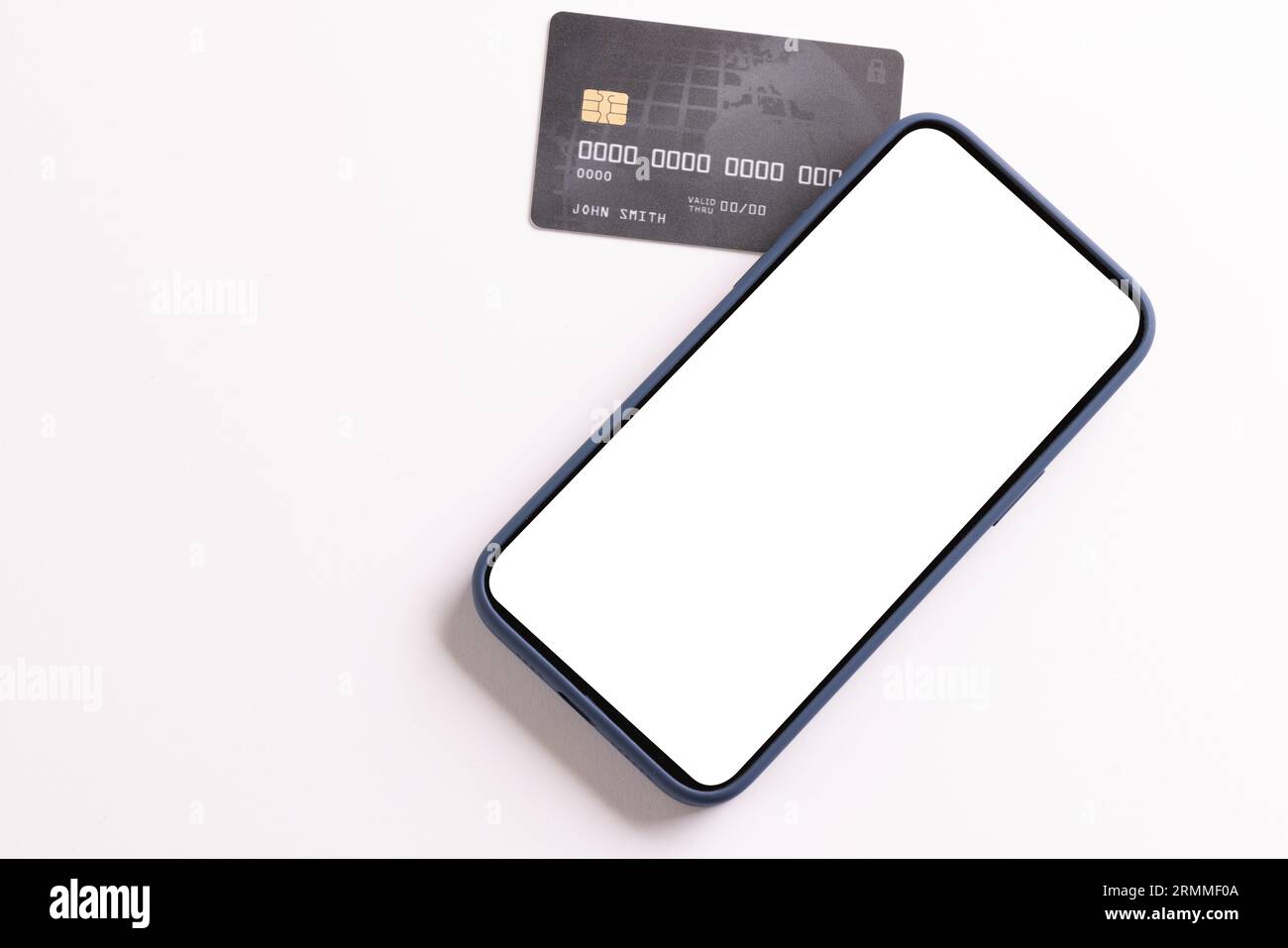 Smartphone with blank screen and credit card on white background Stock ...