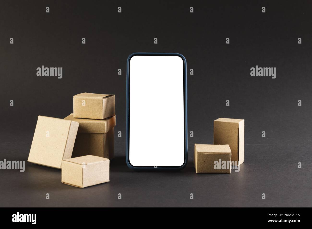 Smartphone with blank screen and cardboard boxes with copy space on ...