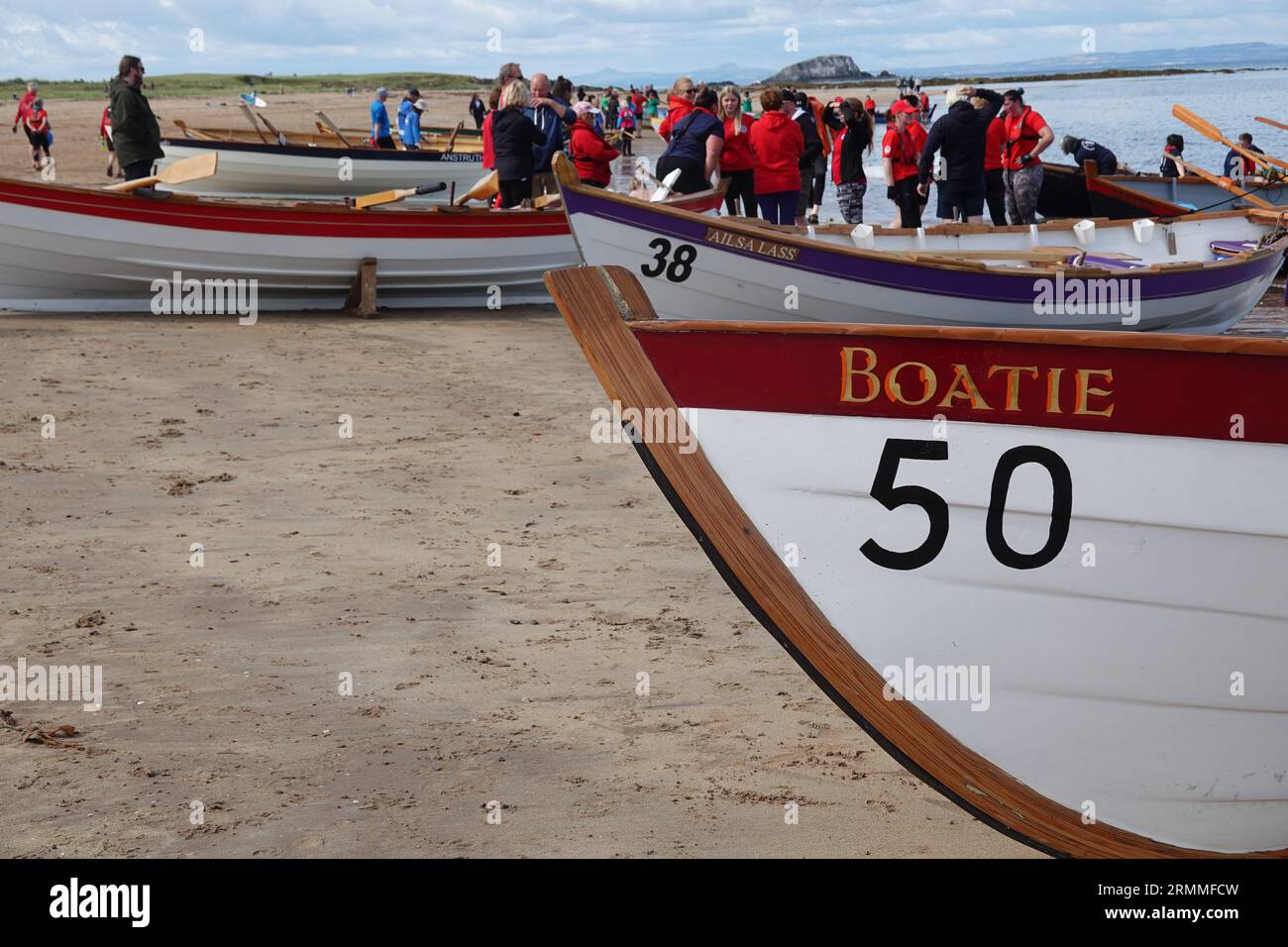 St Ayles Skiffs on shore waiting to go in the North Berwick Rowing Regatta Stock Photo - Alamy