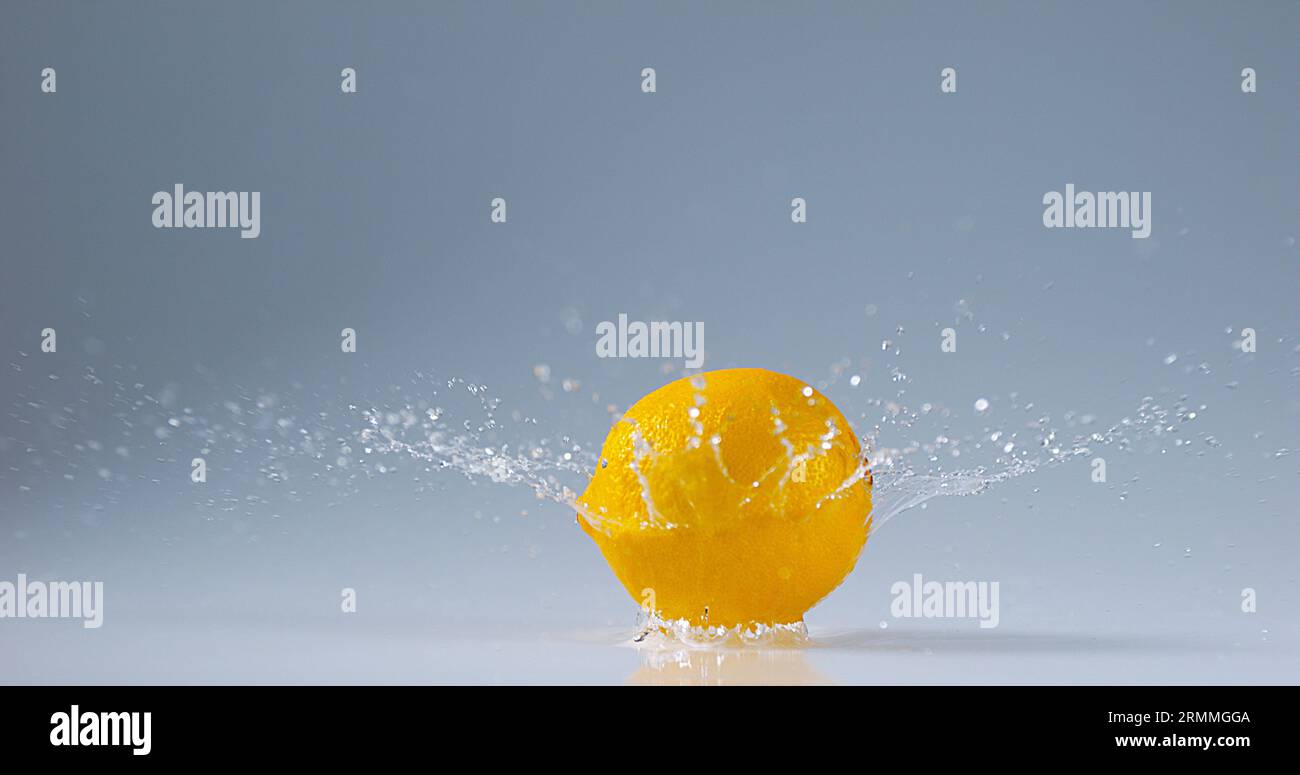 Yellow Lemons, citrus limonum, Fruits falling on Water Stock Photo - Alamy