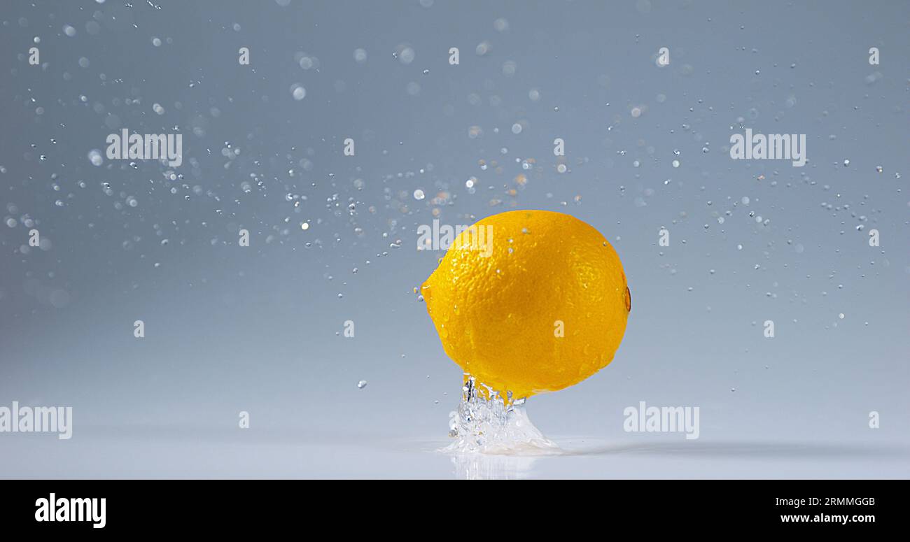 Yellow Lemons, citrus limonum, Fruits falling on Water Stock Photo - Alamy