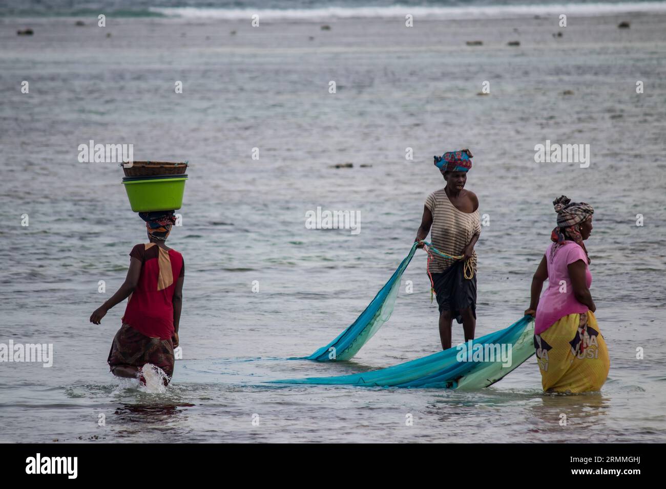 Group of African woman from Mozambique, fishing fish with domestic made ...
