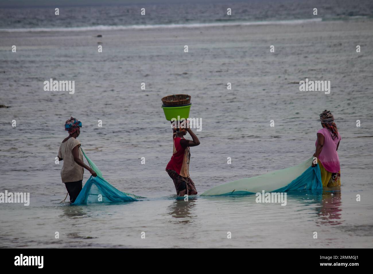 Group of African woman from Mozambique, fishing fish with domestic made ...