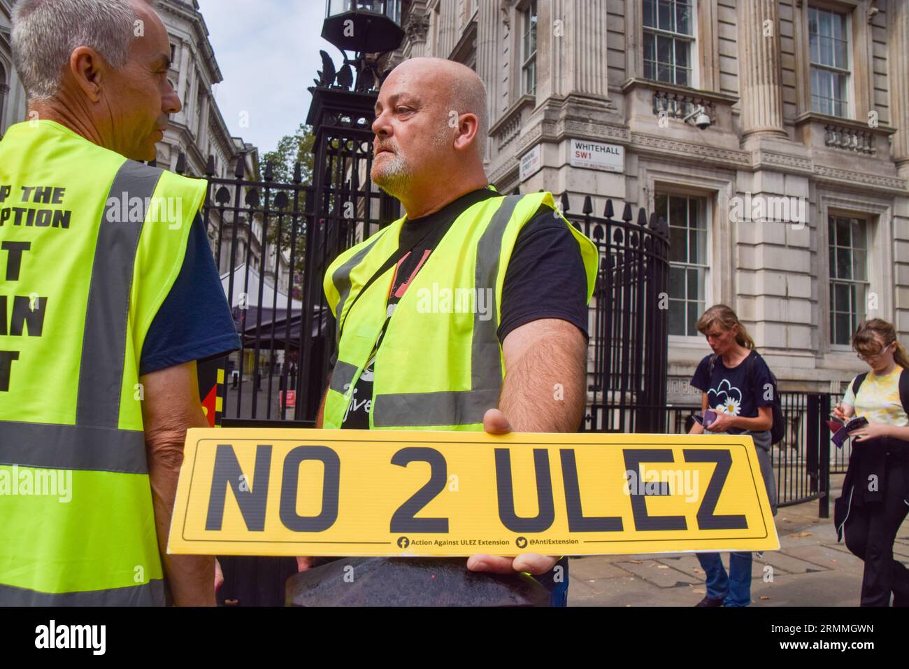 A protester holds an anti-ULEZ placard during the demonstration. Anti ...