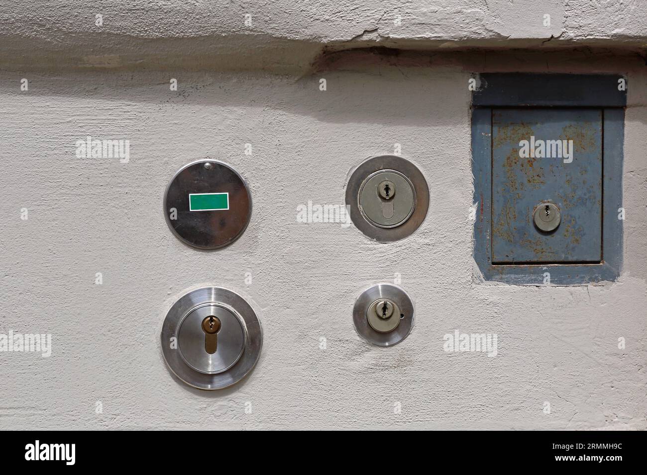 Many Keyholes in Wall at Building Exterior Access Point Security Device ...